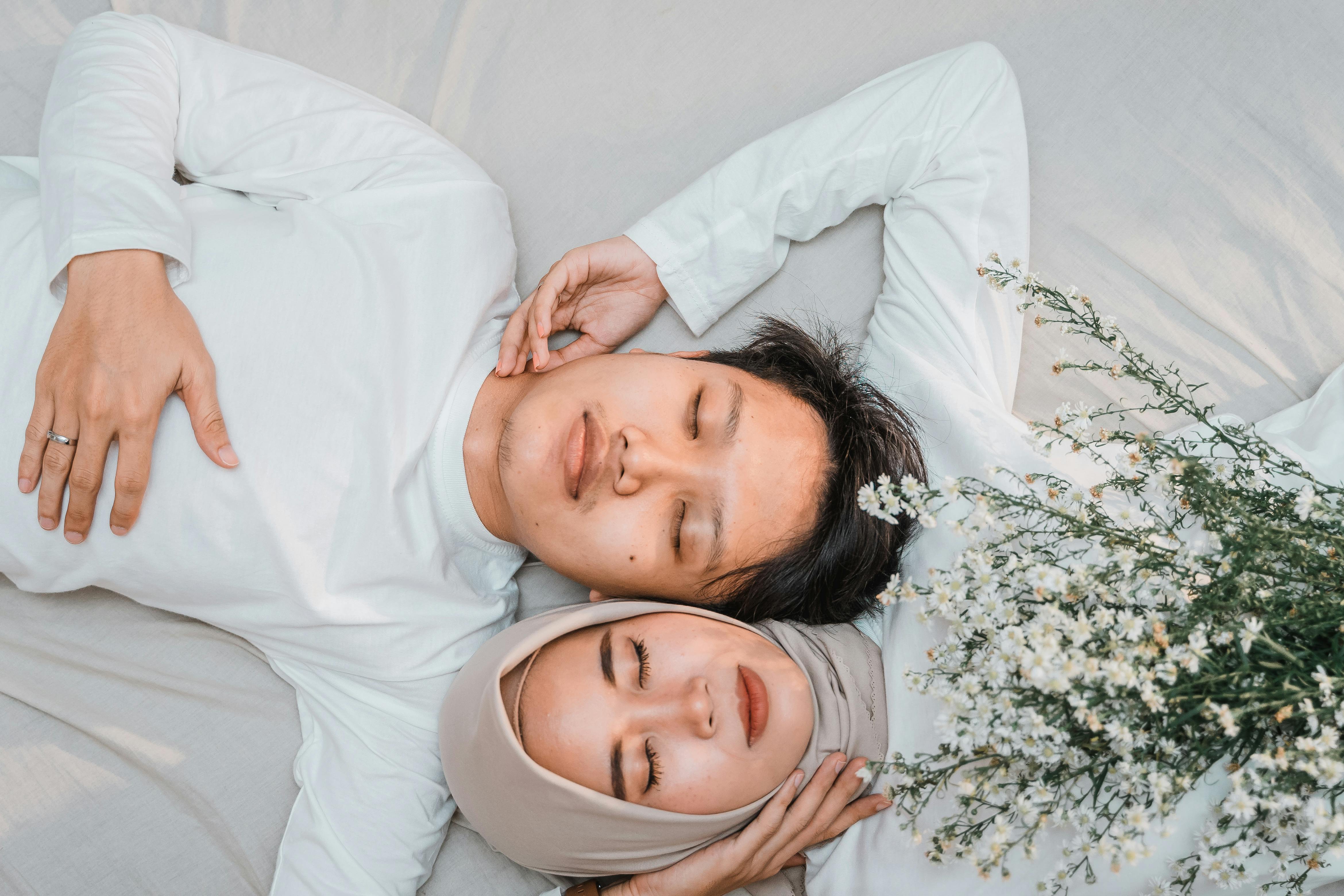 A Couple Lying Down beside Each Other · Free Stock Photo