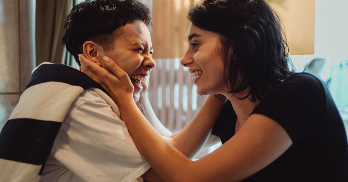 Profiles Of Two Brunettes Touching Each Others Faces And Smiling · Free
