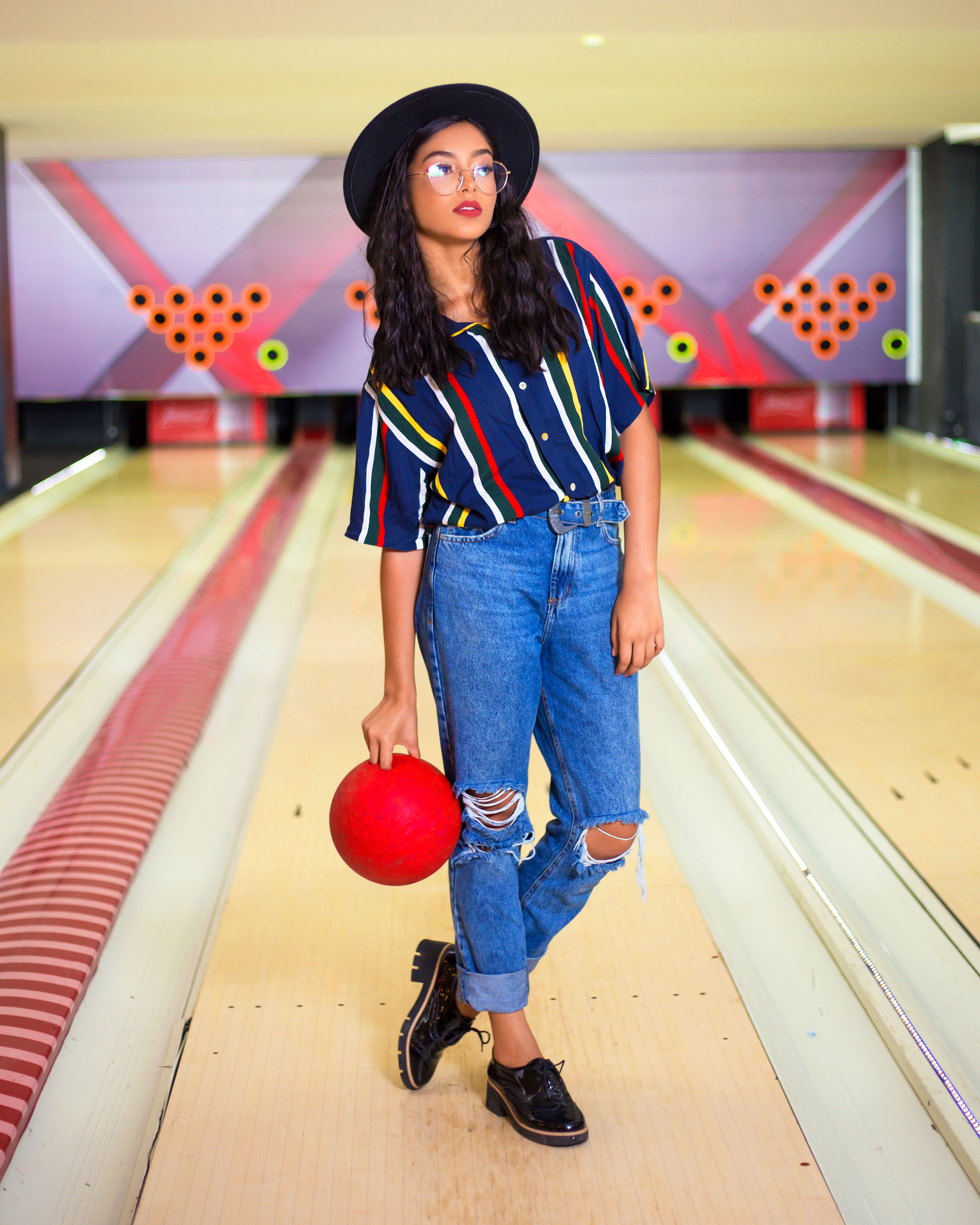 Stylish female in bowling alley · Free Stock Photo