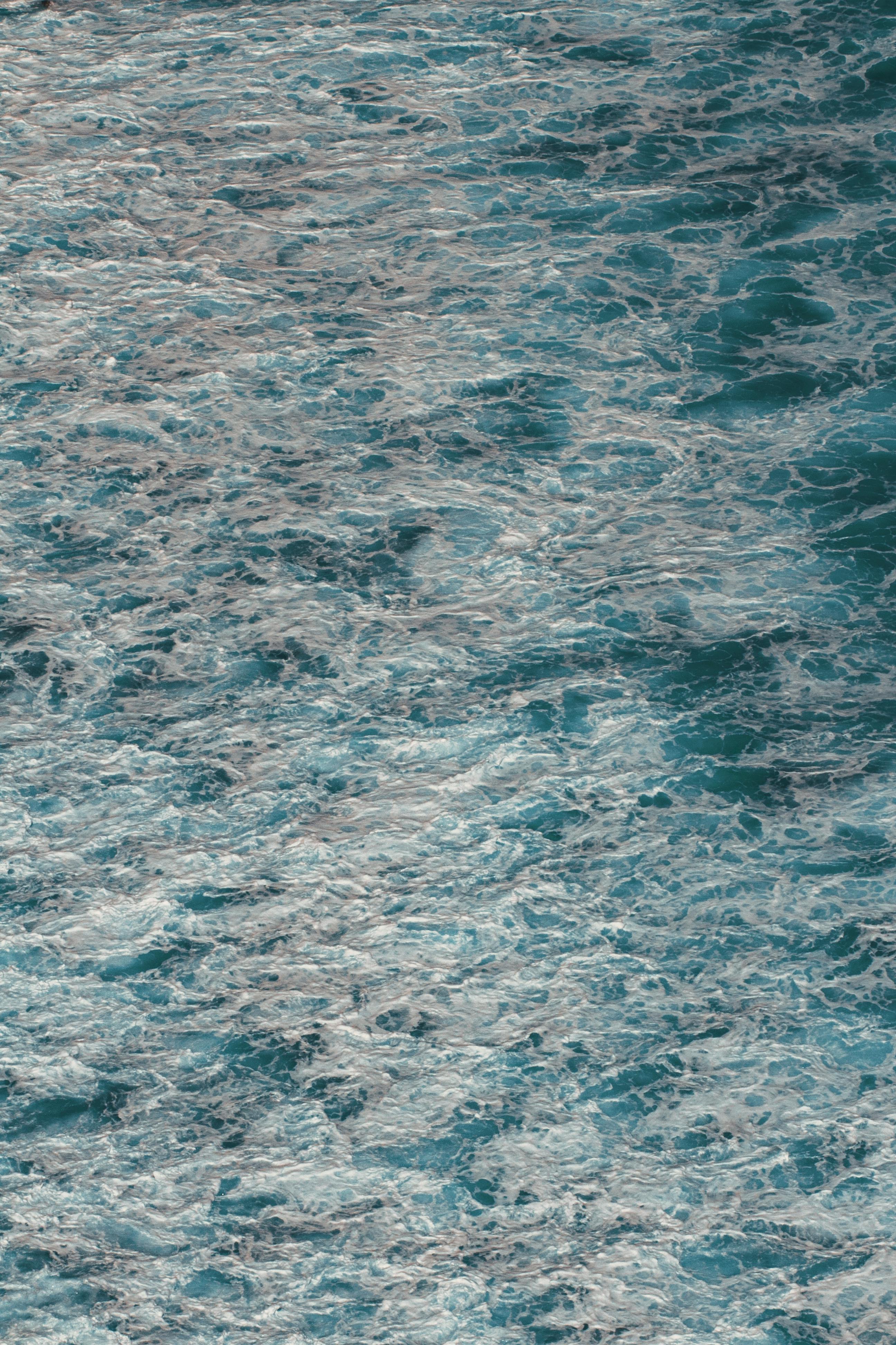 Sea Water Forming Seafoams · Free Stock Photo