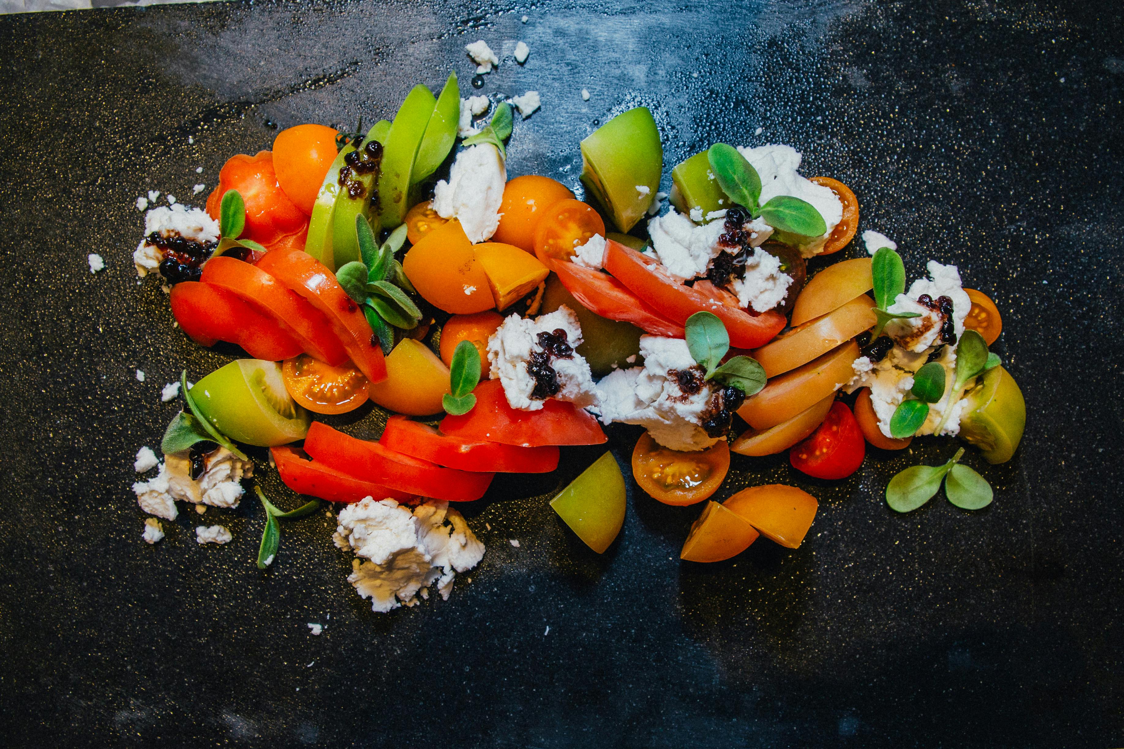 Fresh Sliced Tomatoes on Table · Free Stock Photo