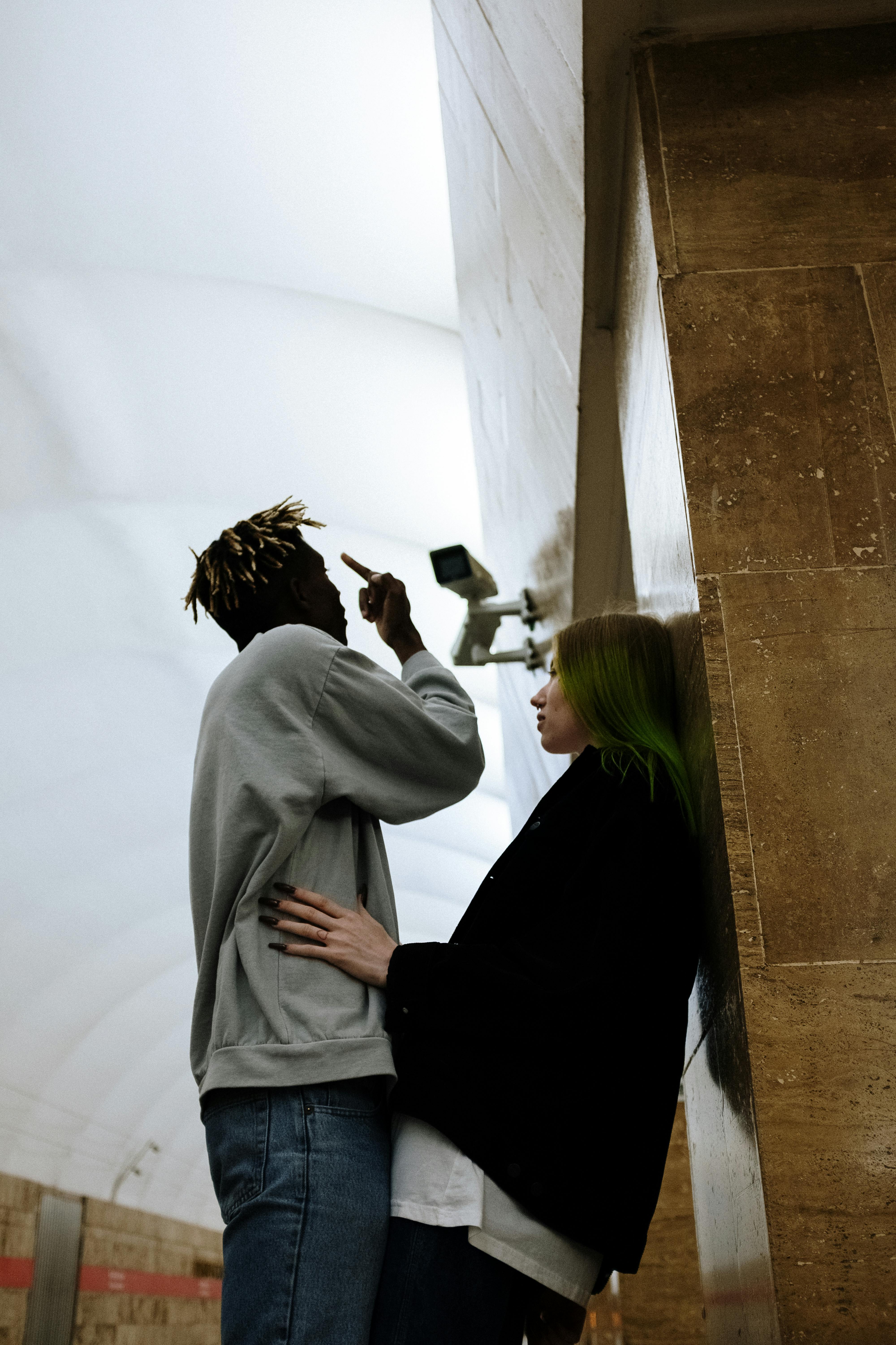 Person Sitting on Escalator · Free Stock Photo