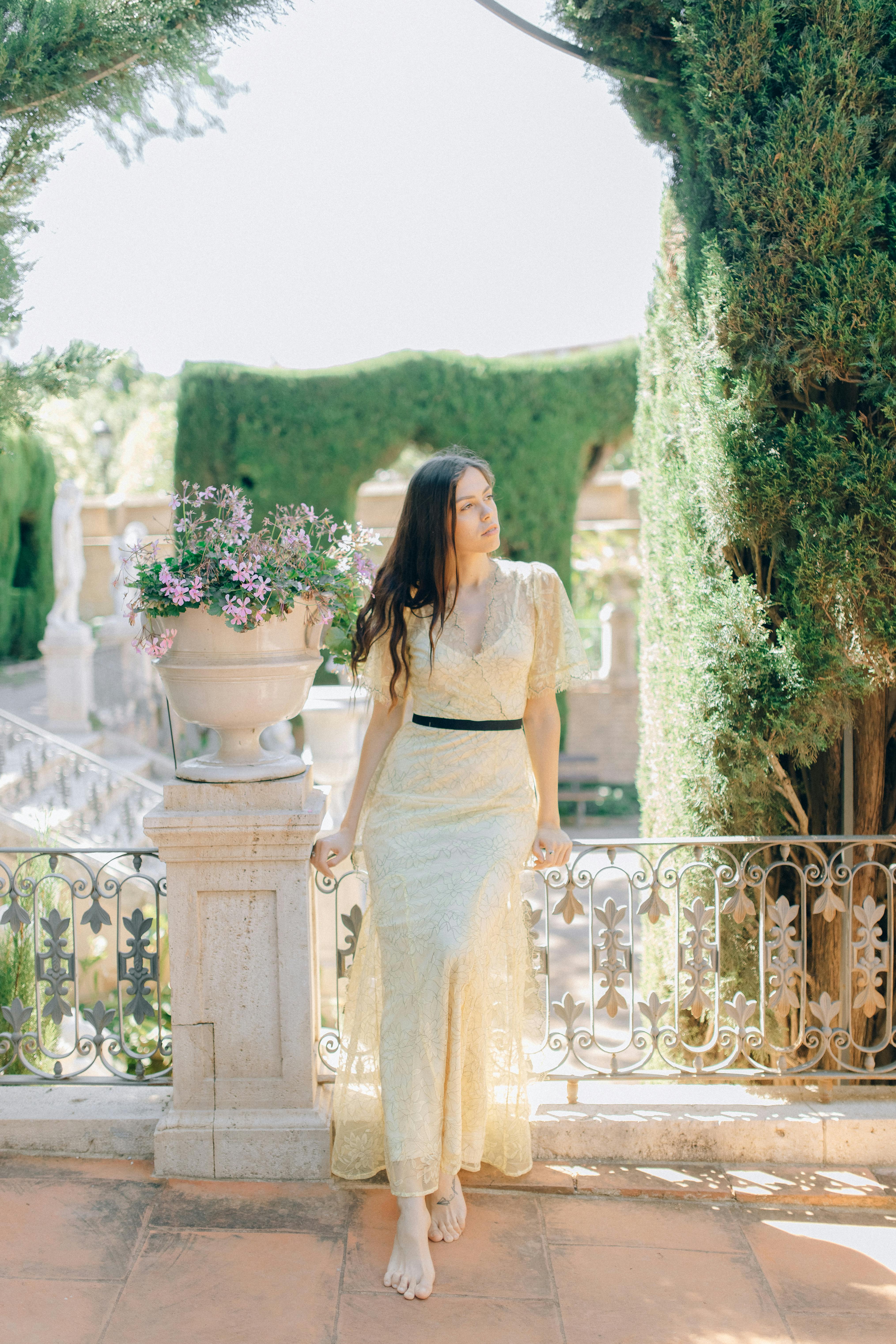 Woman Leaning on a Railing · Free Stock Photo