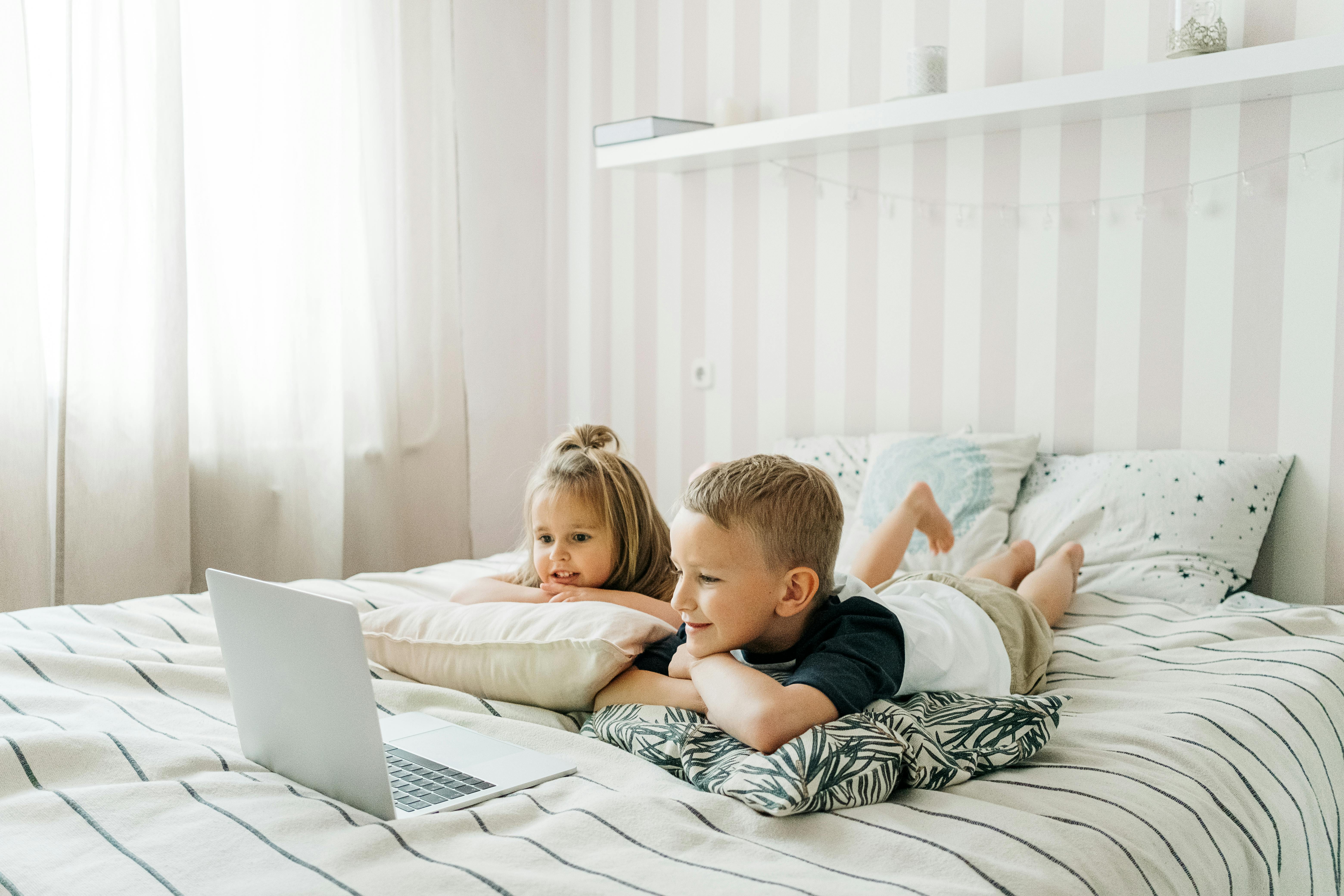Kids Lying on the Bed · Free Stock Photo