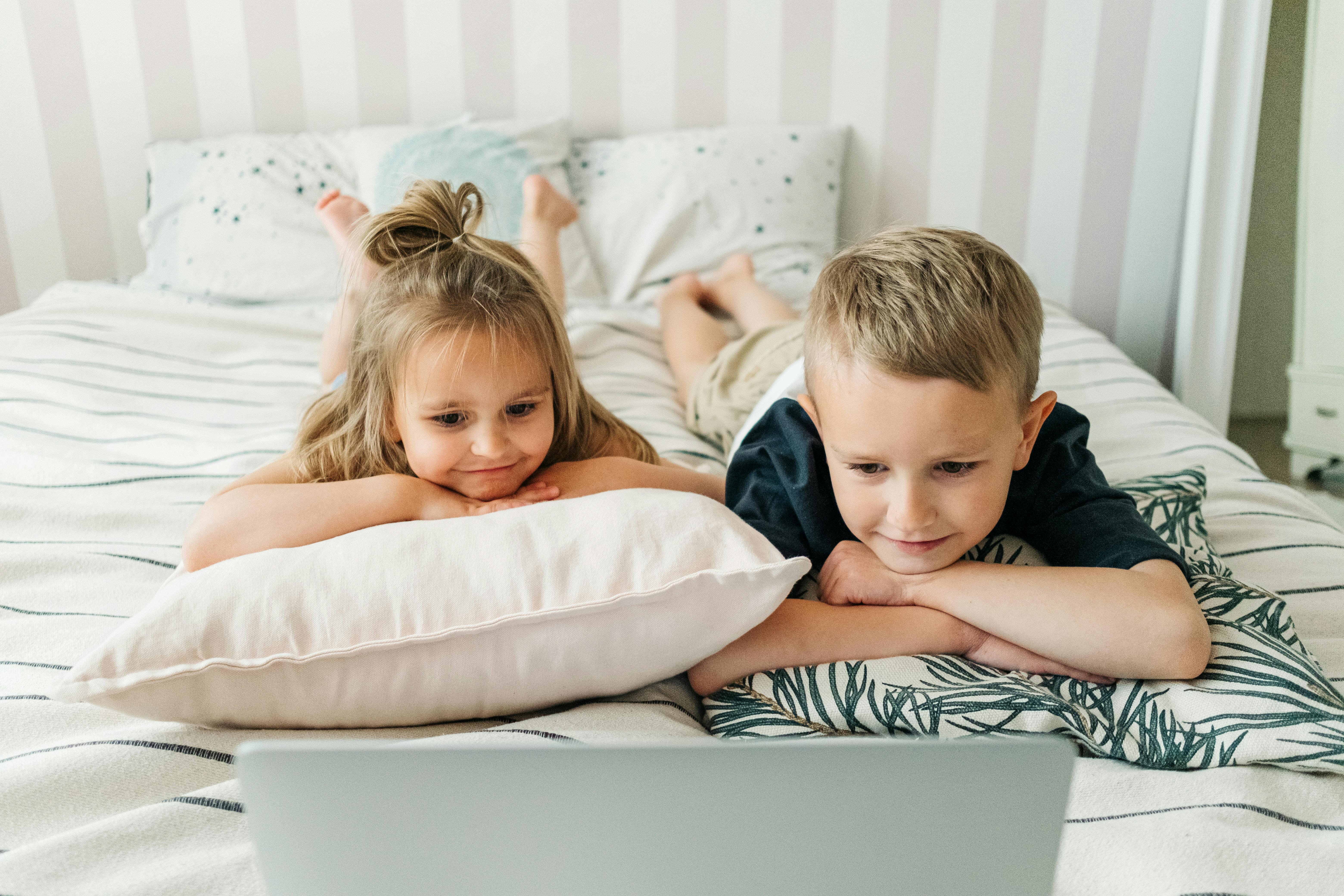 Siblings Watching on a Laptop · Free Stock Photo