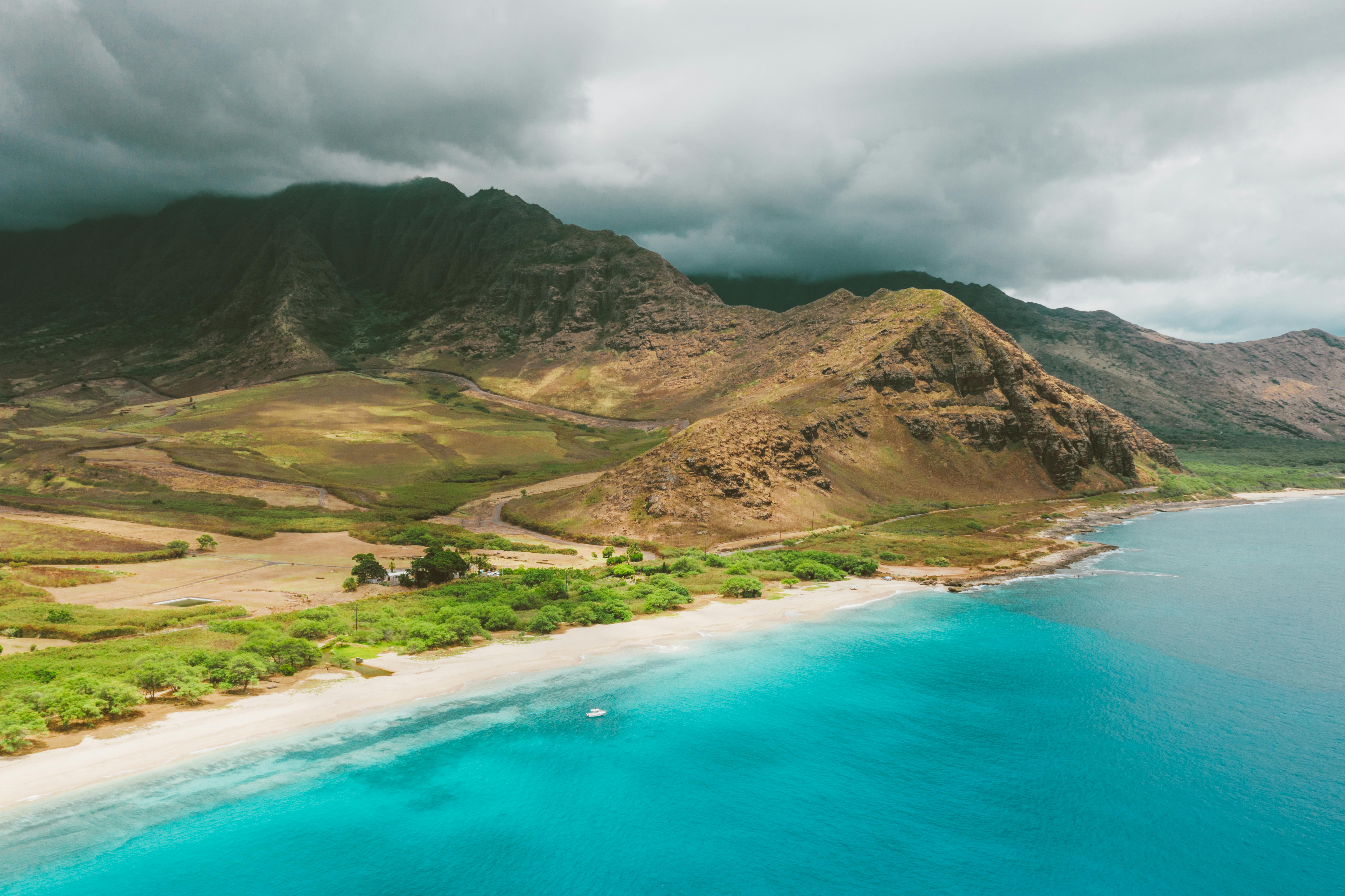 Mountain Range Near a Body of Water · Free Stock Photo