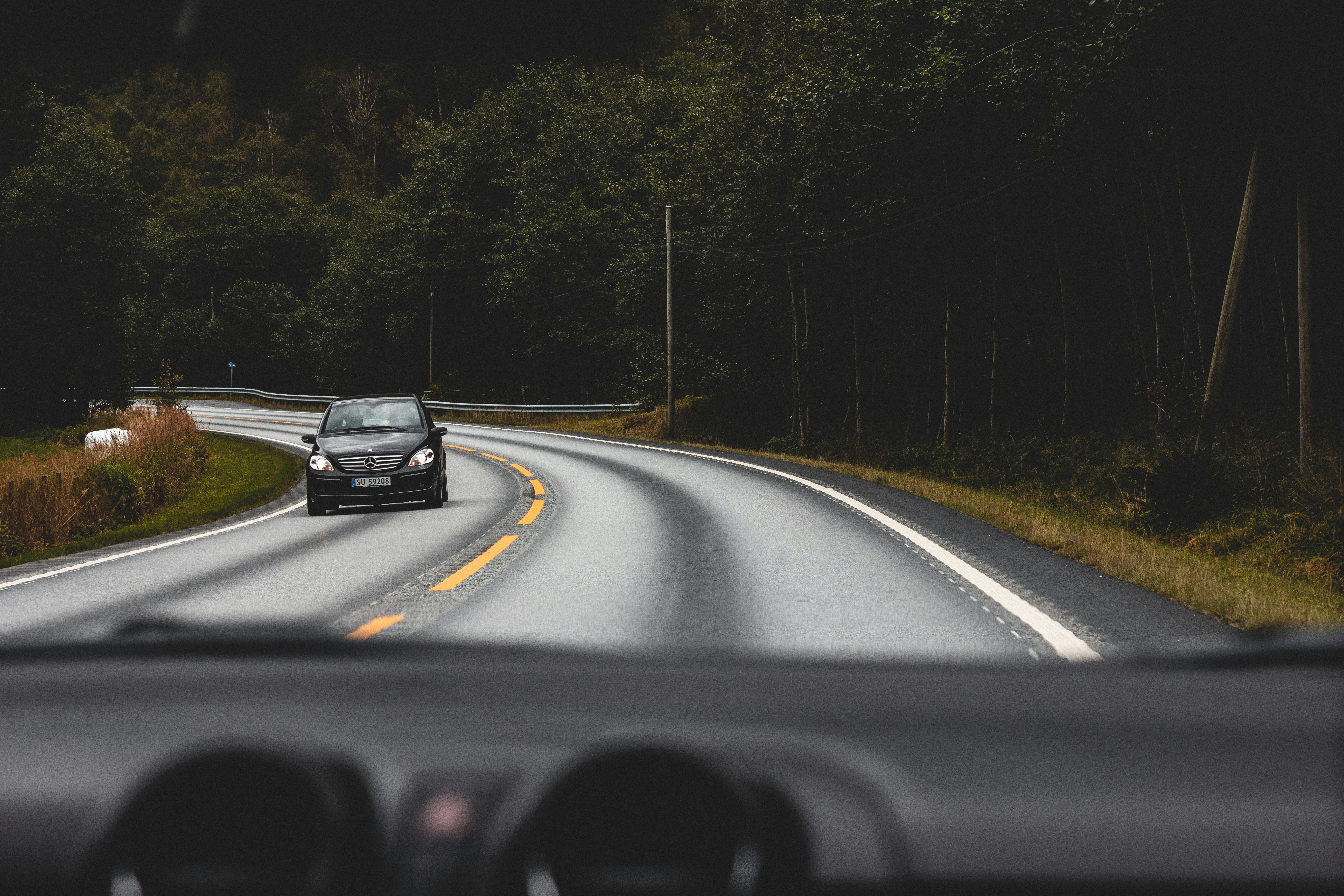 Brown Asphalt Road Beside Lake · Free Stock Photo