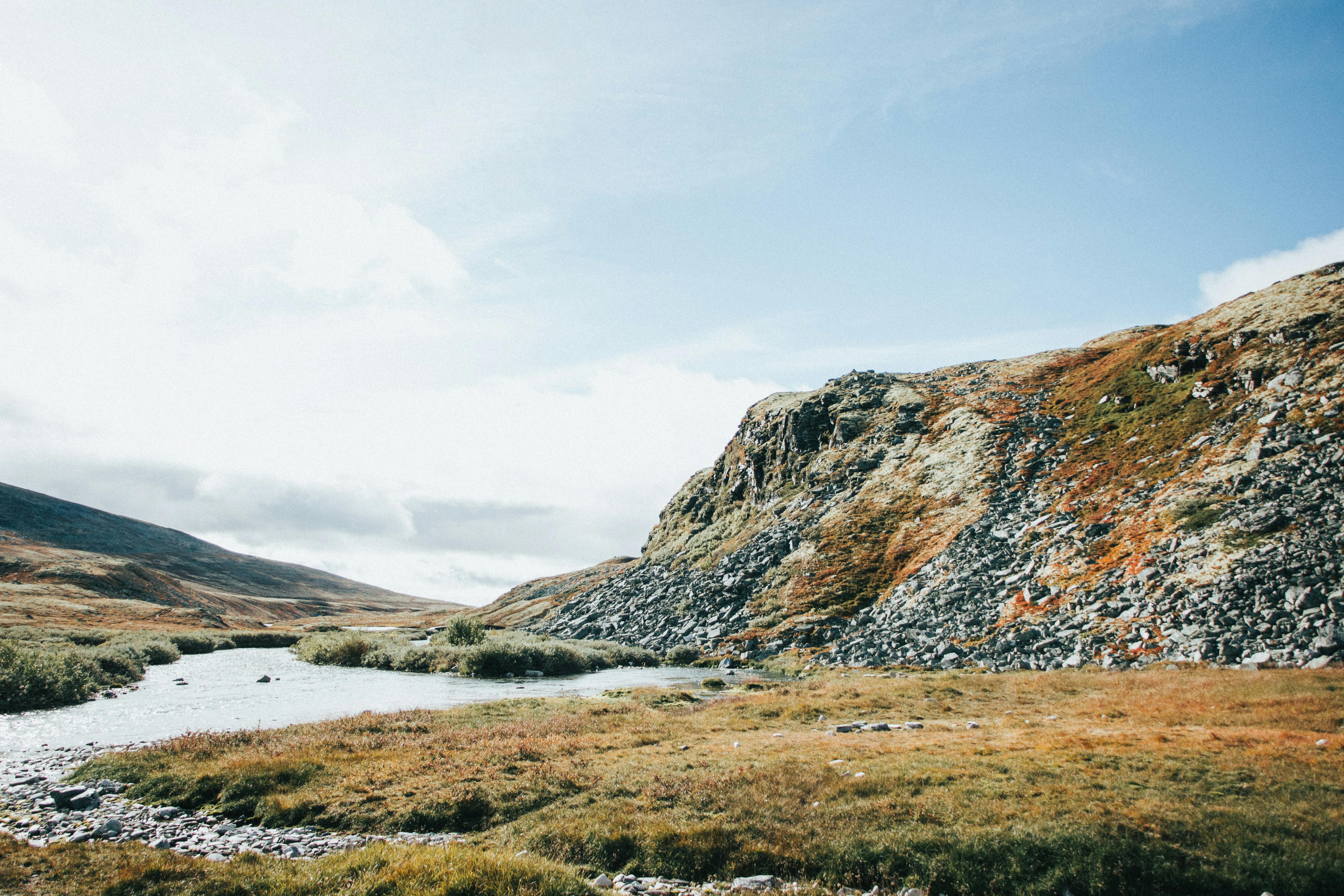A Beautiful Scenery of Mountains and a River · Free Stock Photo