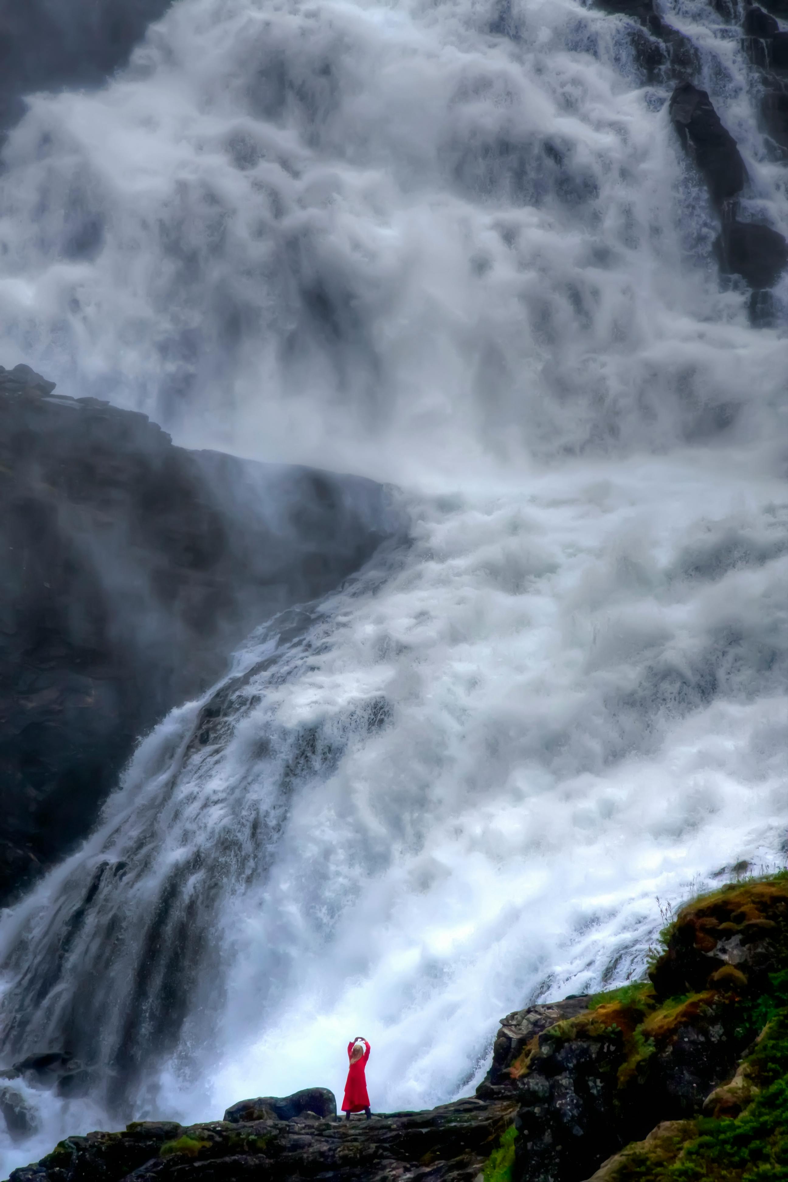 Waterfalls Beside a Brick Building · Free Stock Photo