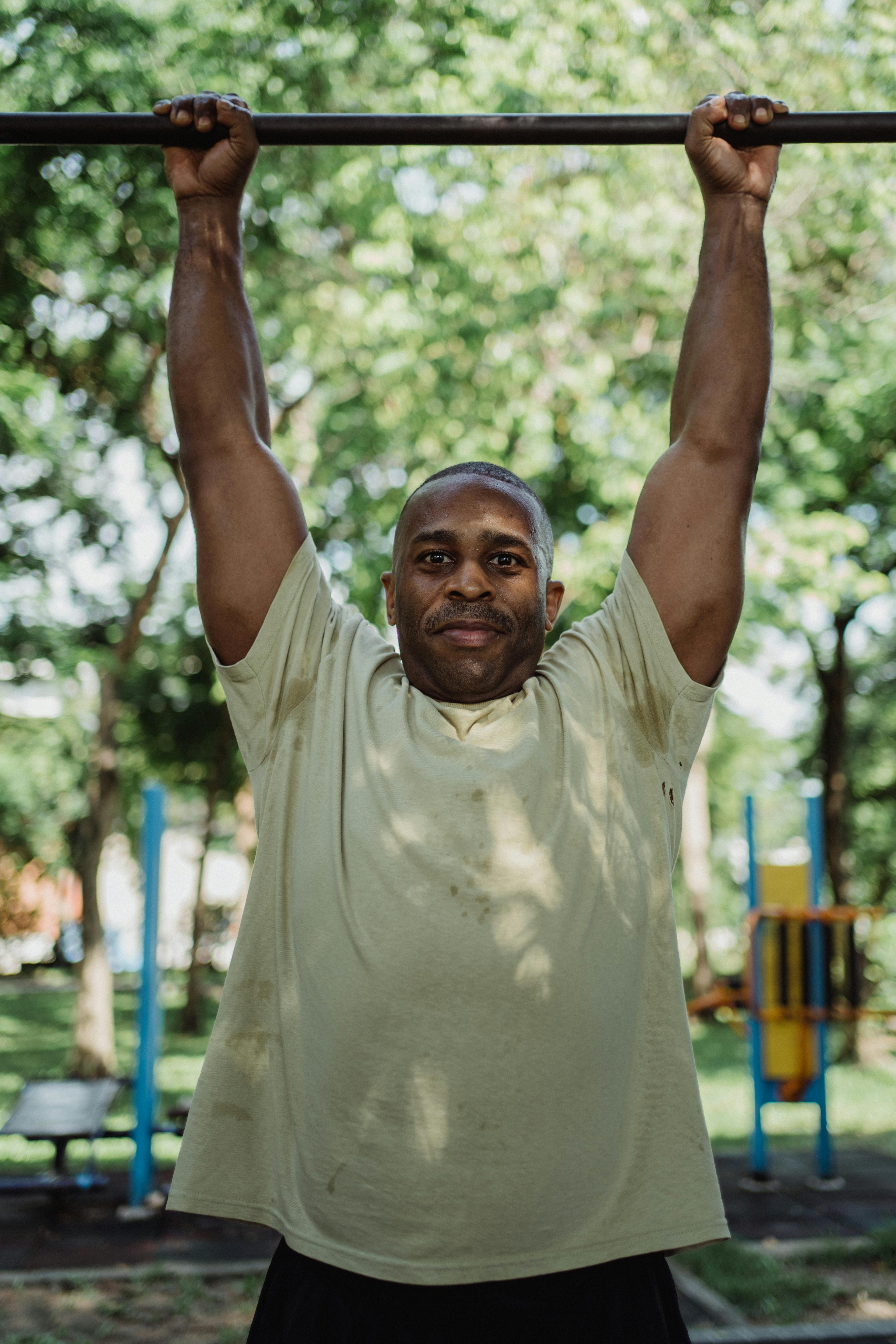 Man Doing a Dead Hang Exercise · Free Stock Photo