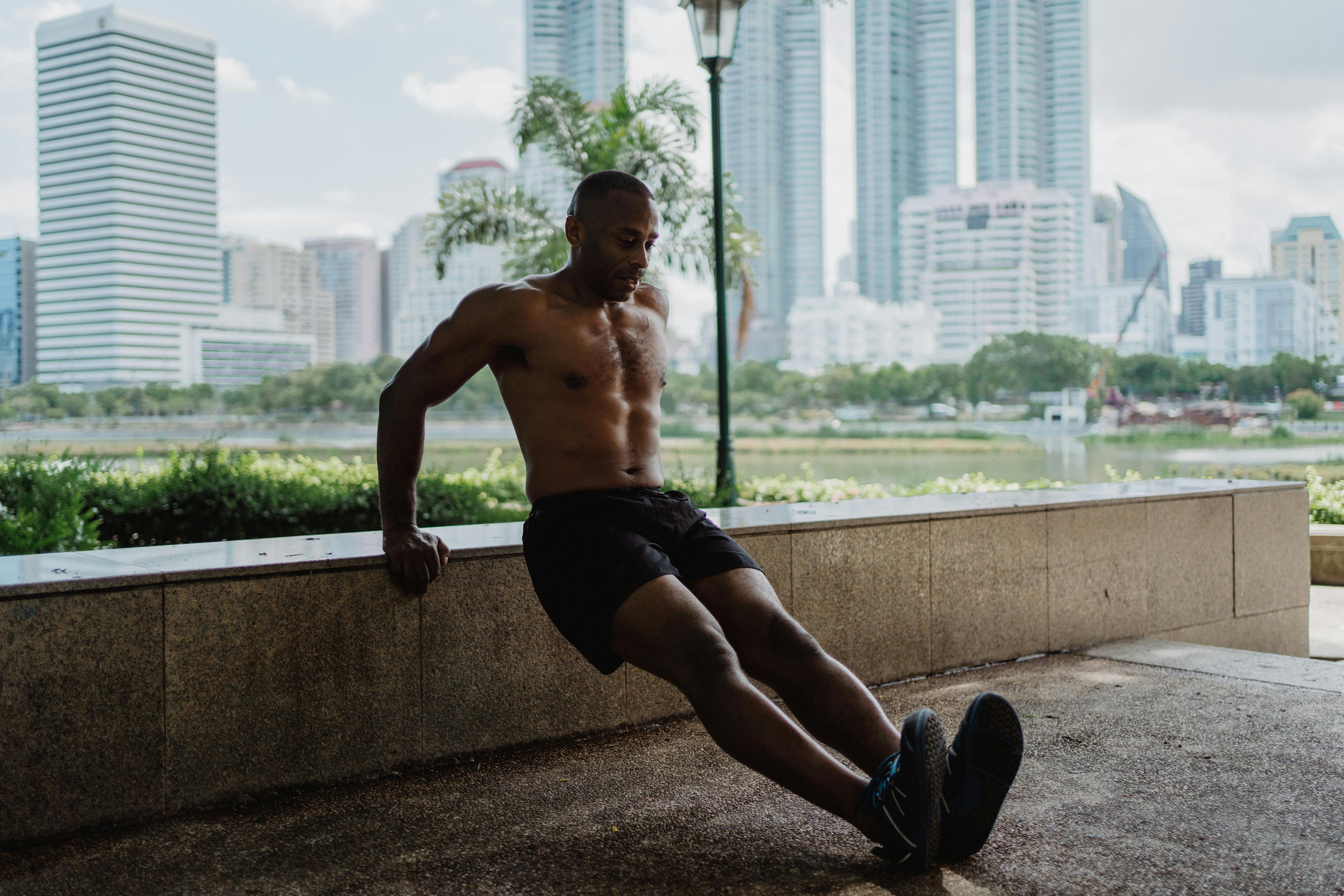 A Man Doing a Tricep Dip · Free Stock Photo