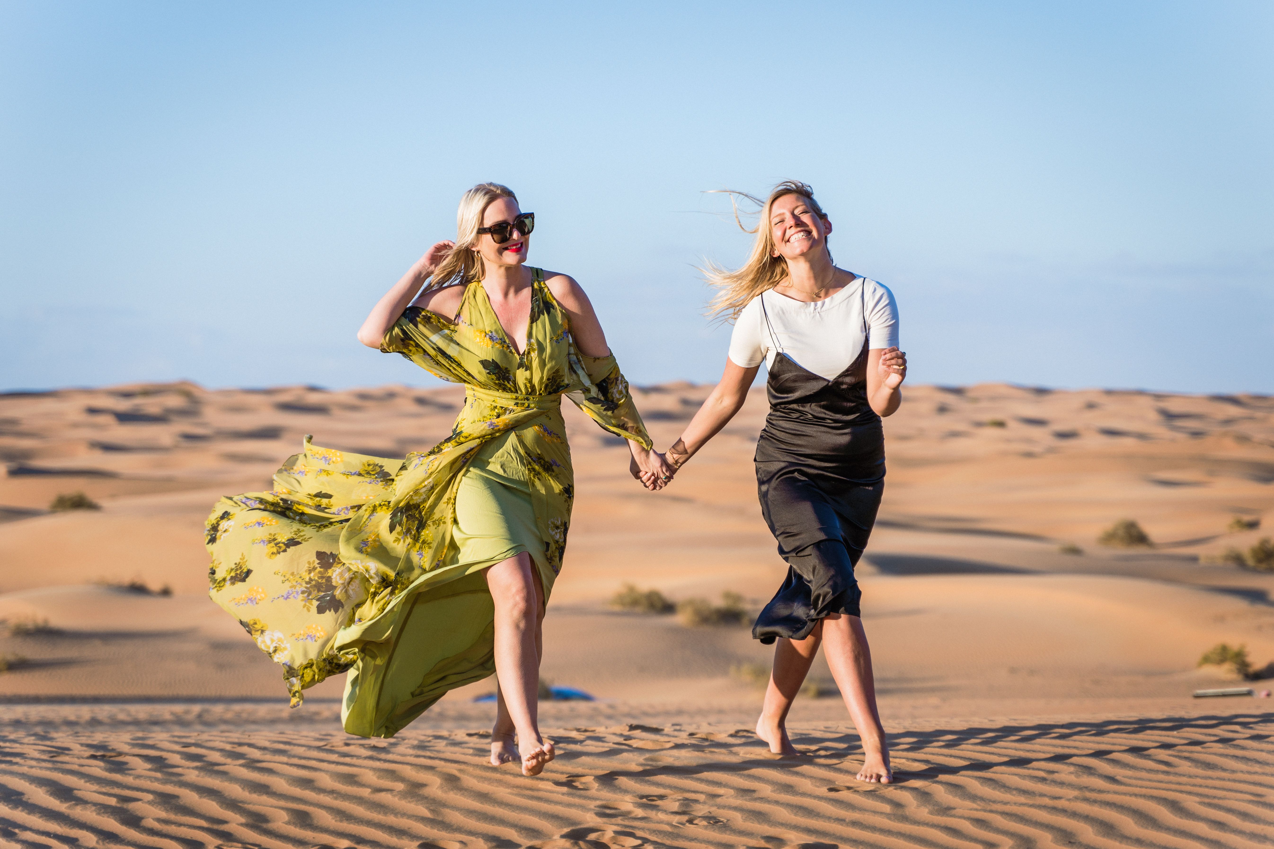 Women in Transparent Raincoats Walking while Holding Hands · Free Stock ...