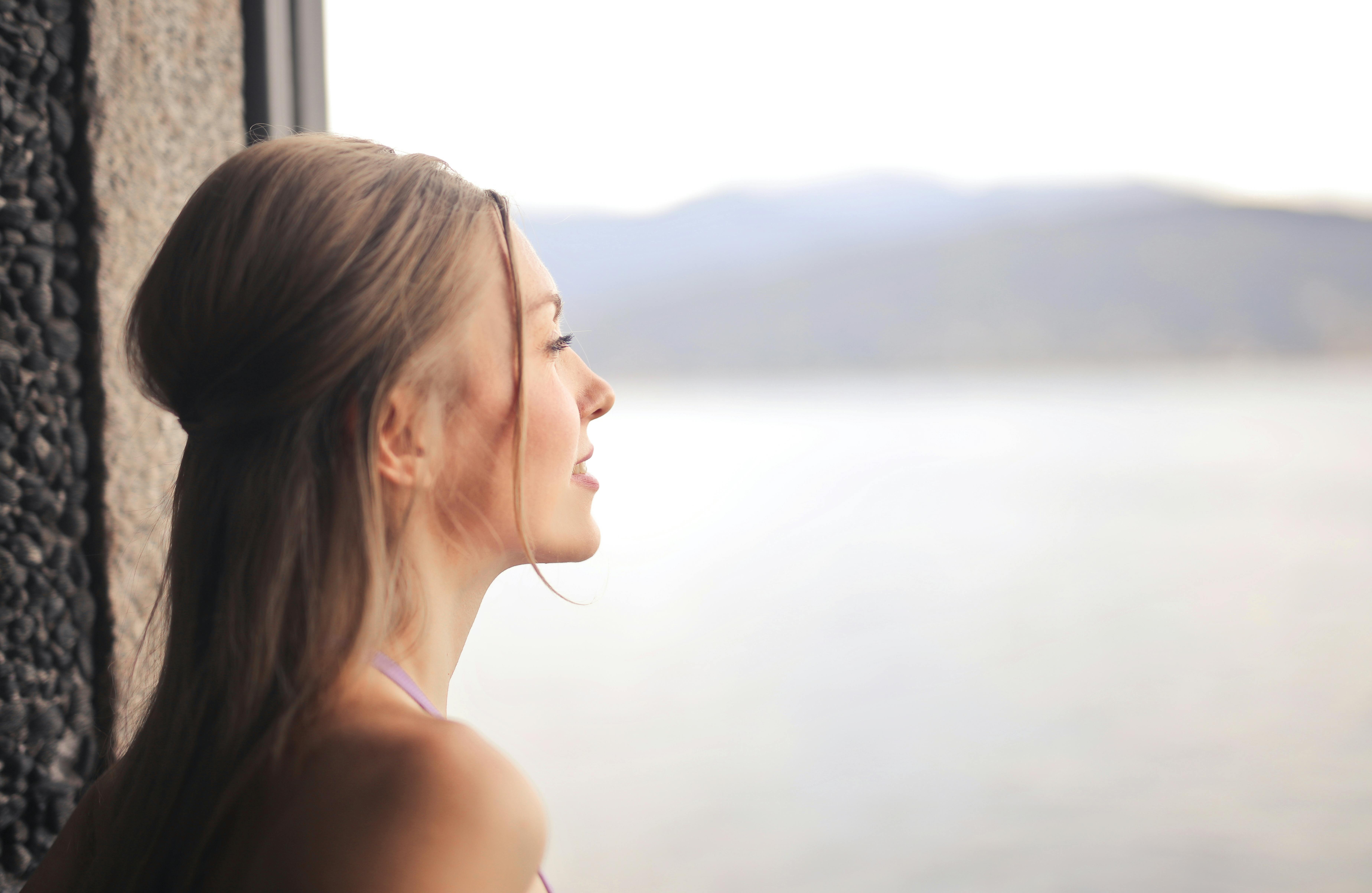 Side Profile of Woman Looking Outside The Window · Free Stock Photo