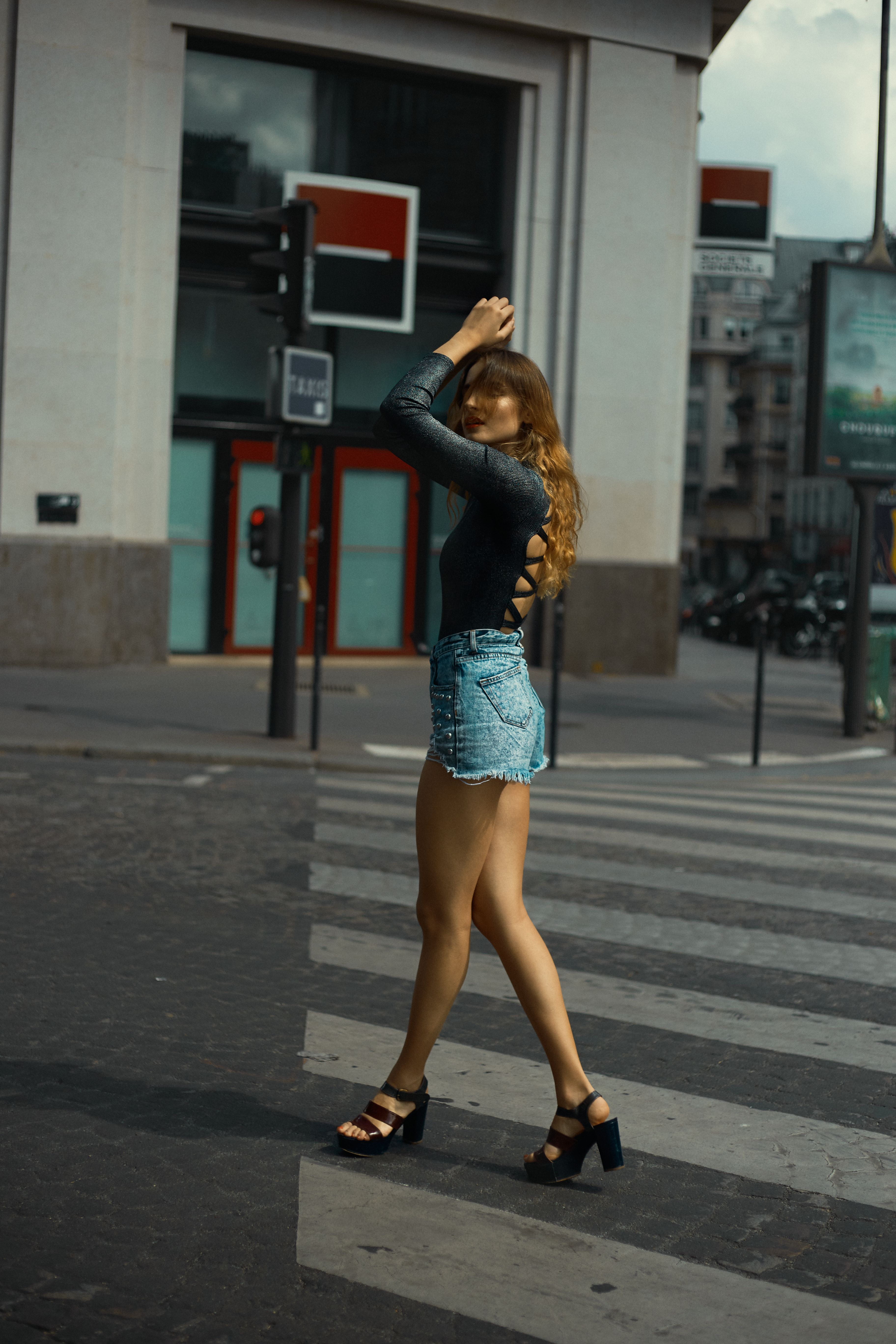 Stylish young woman walking on crosswalk in city downtown · Free Stock ...