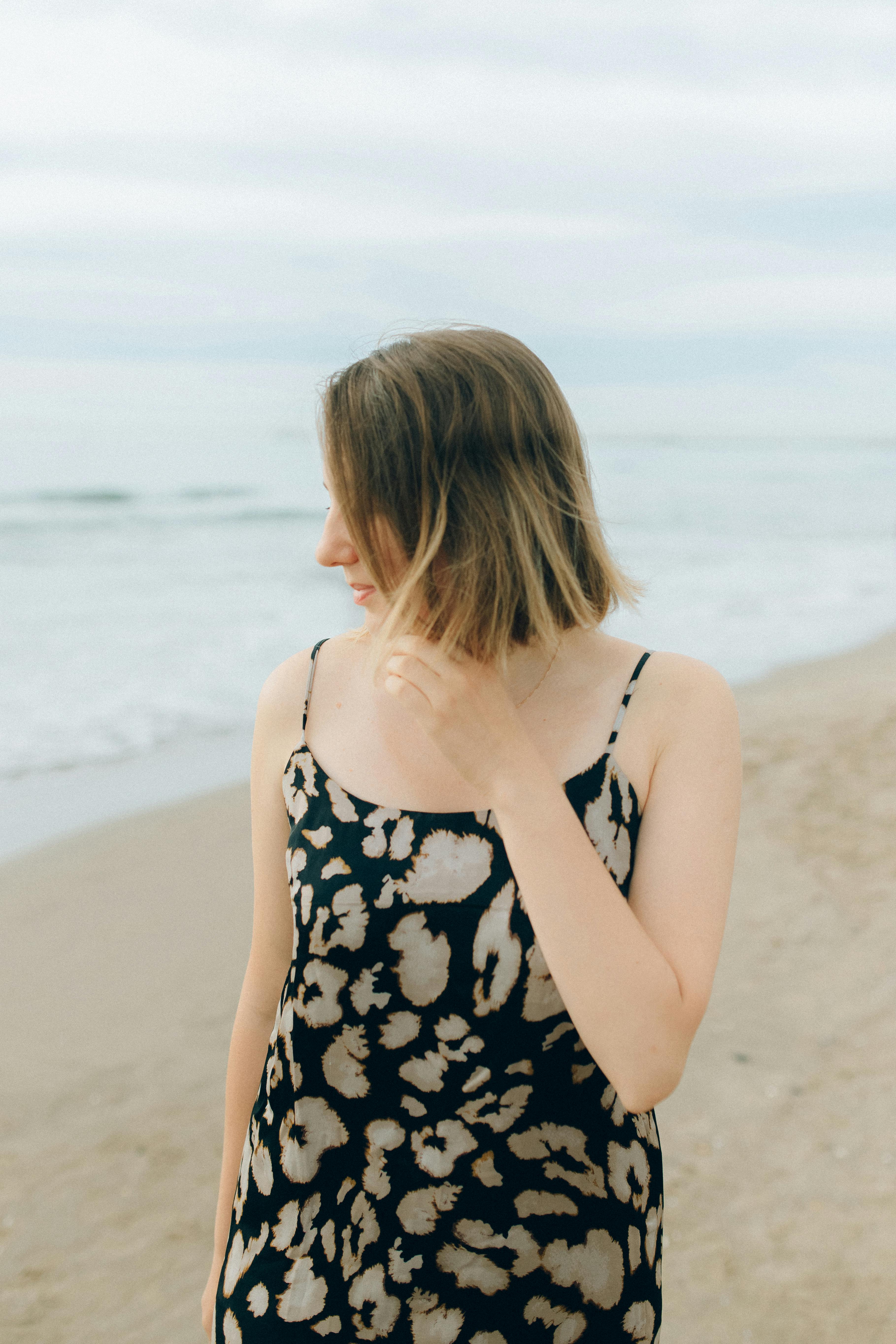 A Woman Wearing a Spaghetti Strap Dress on a Shore · Free Stock Photo
