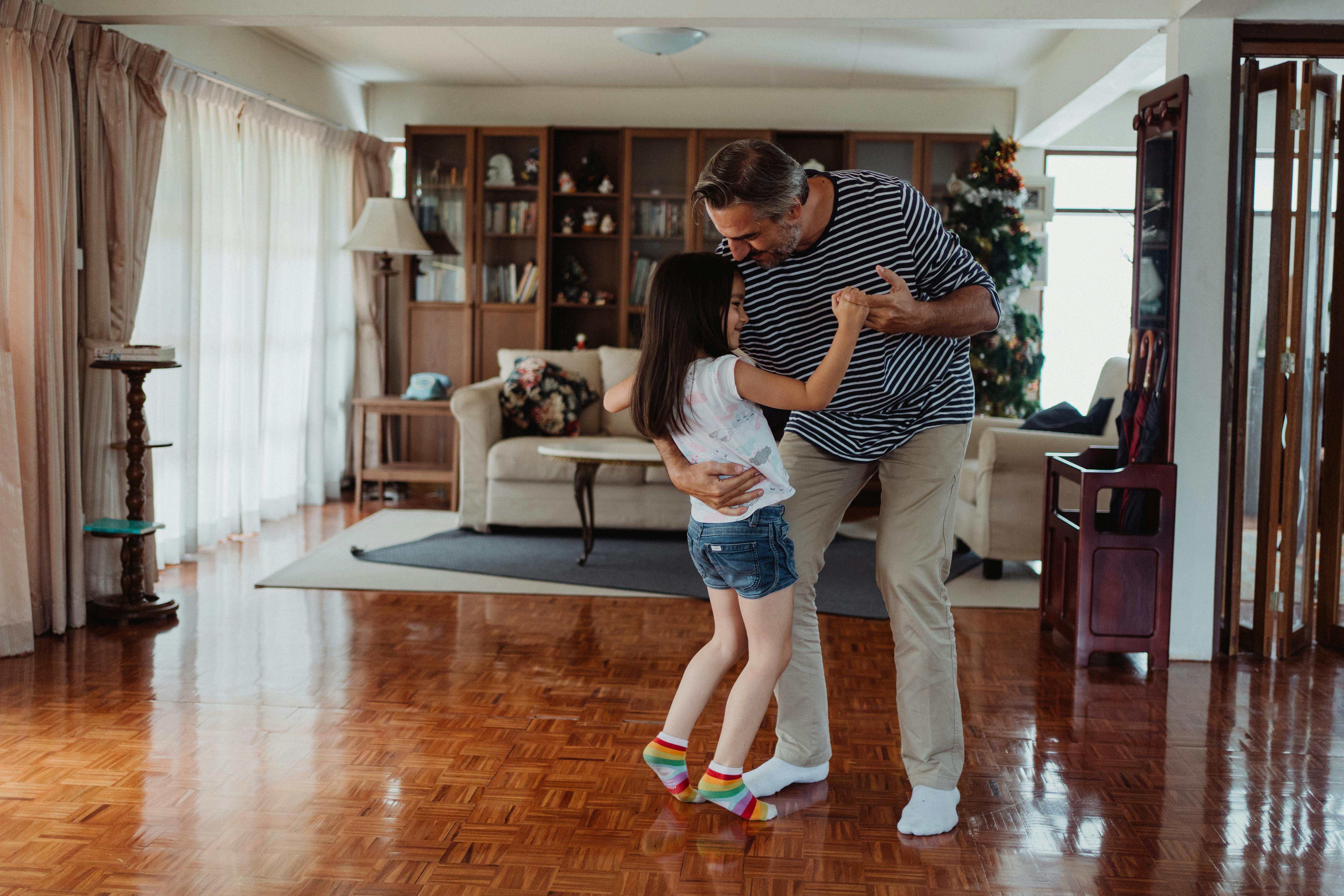 Father Dancing with Daughter in Living Room · Free Stock Photo