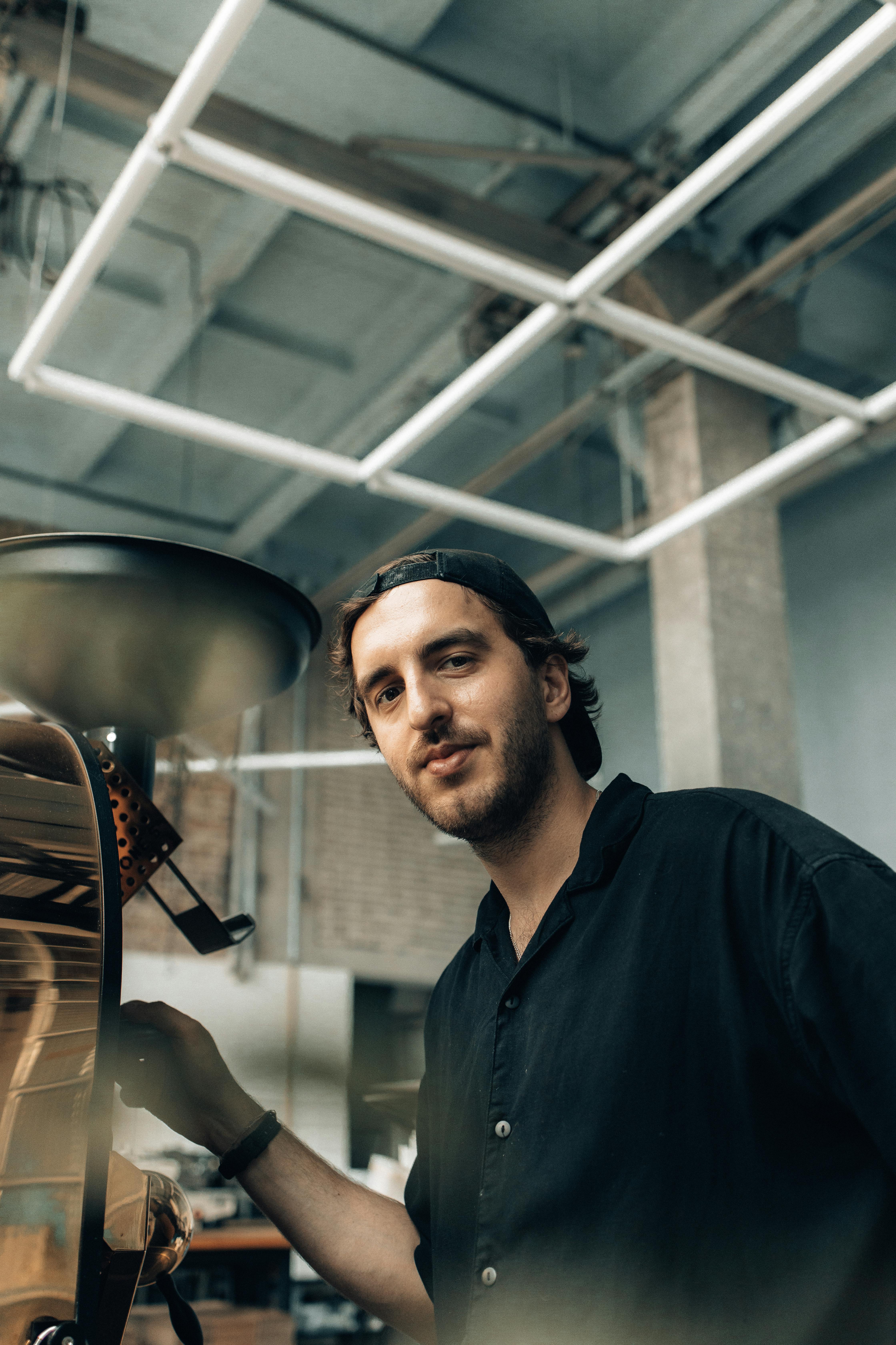 A Man Using a Coffee Machine · Free Stock Photo