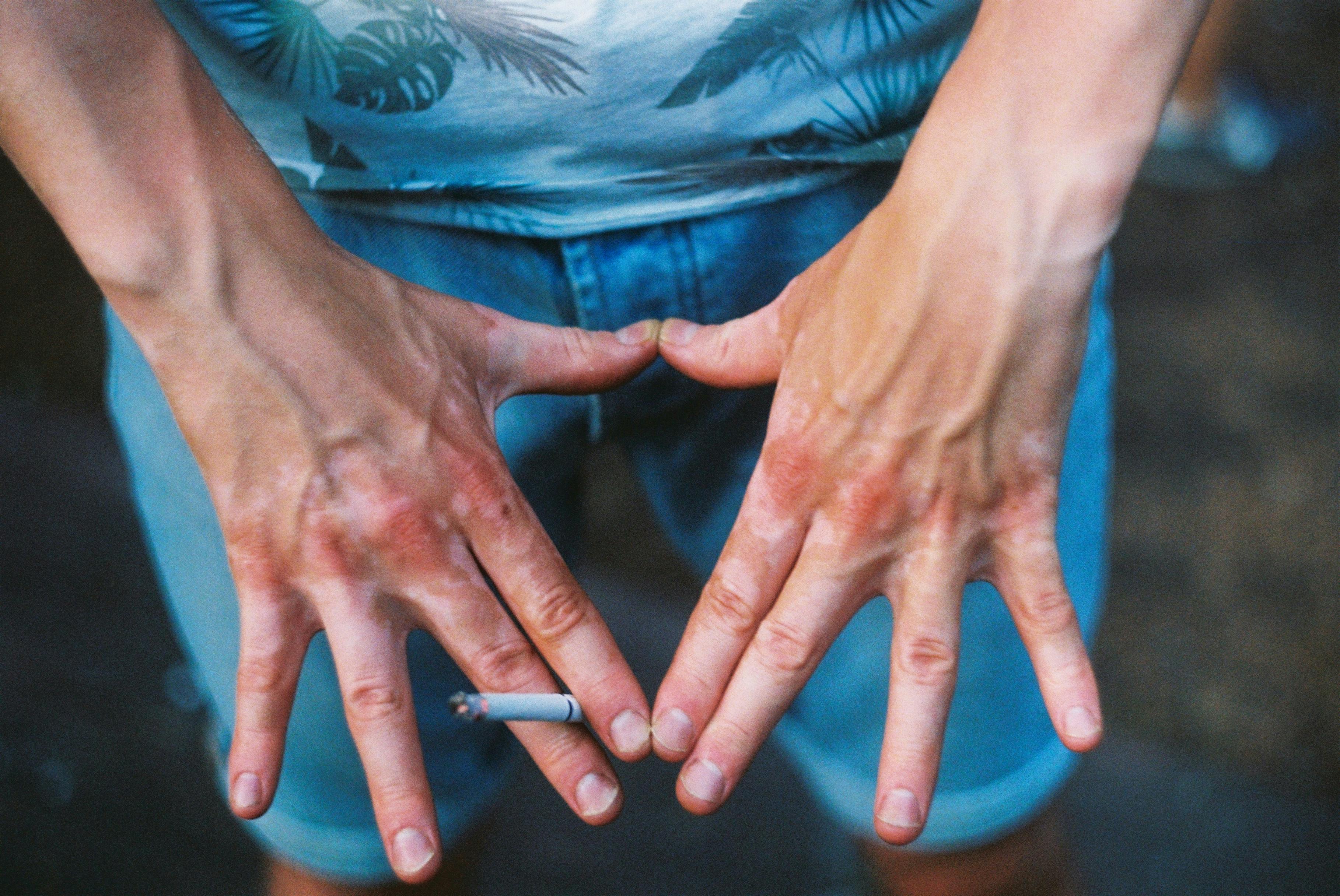 Stylish woman smoking on street · Free Stock Photo