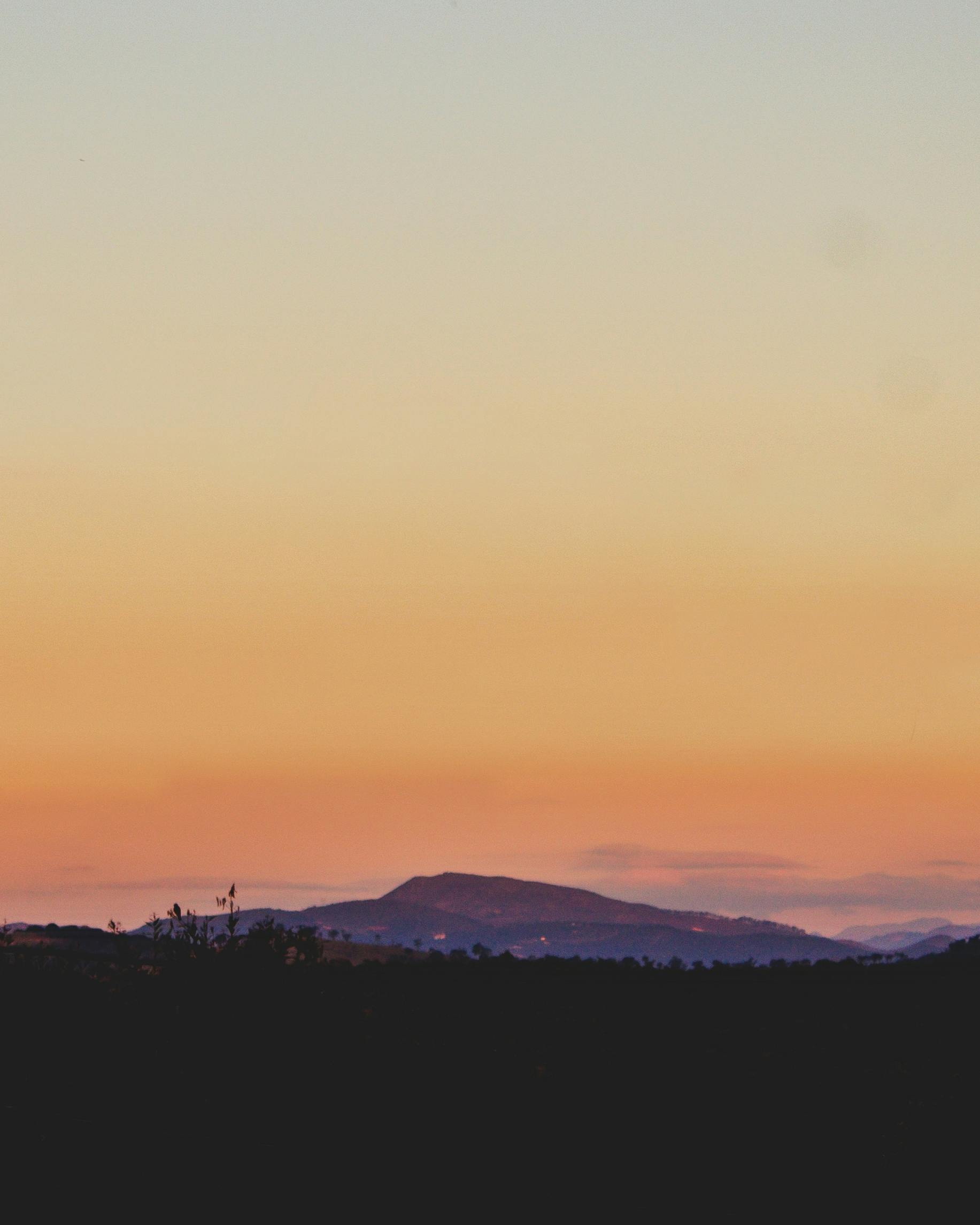 Picturesque view of mountain at sunset · Free Stock Photo