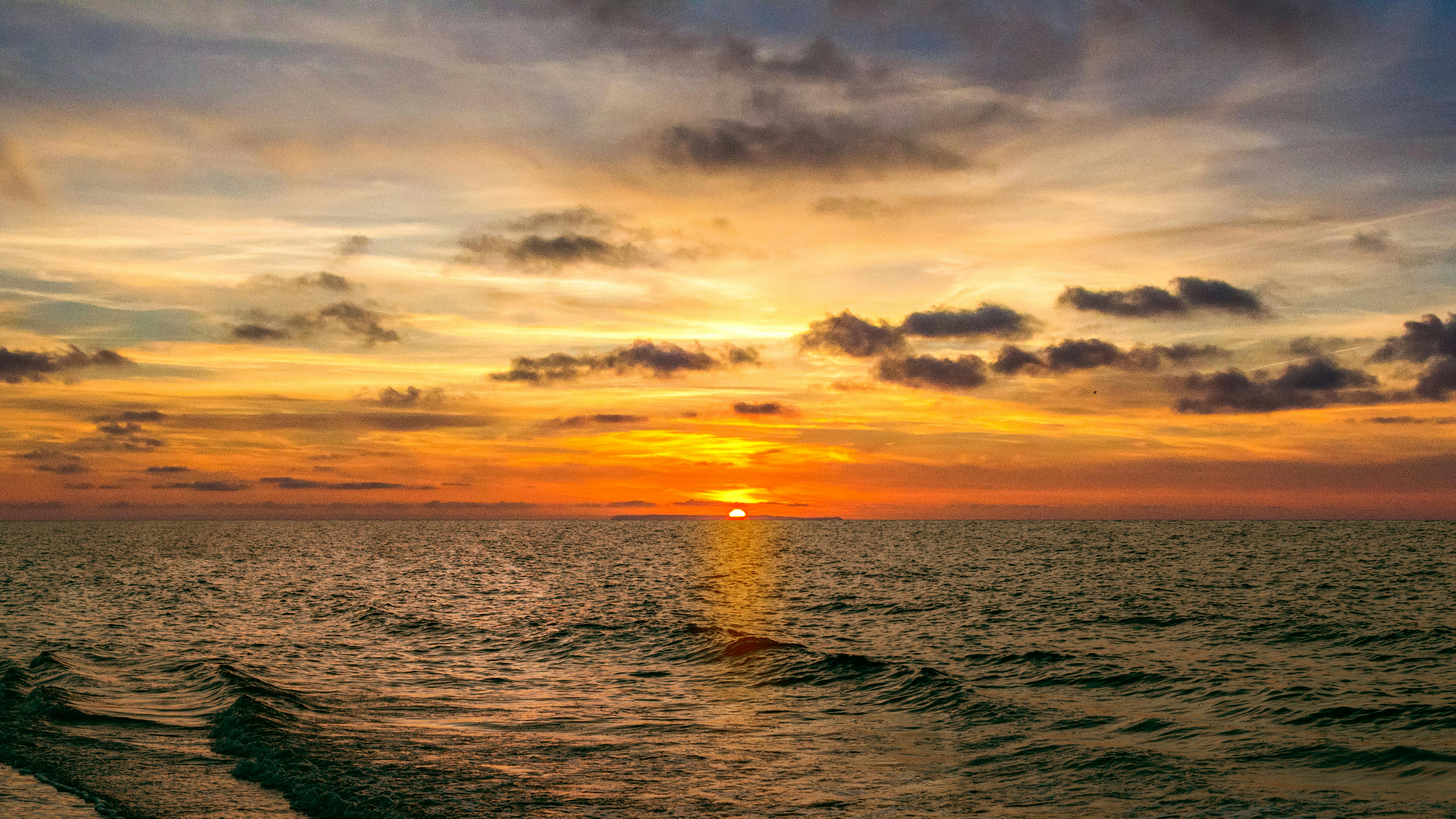 Waves of an Ocean During Sunset · Free Stock Photo