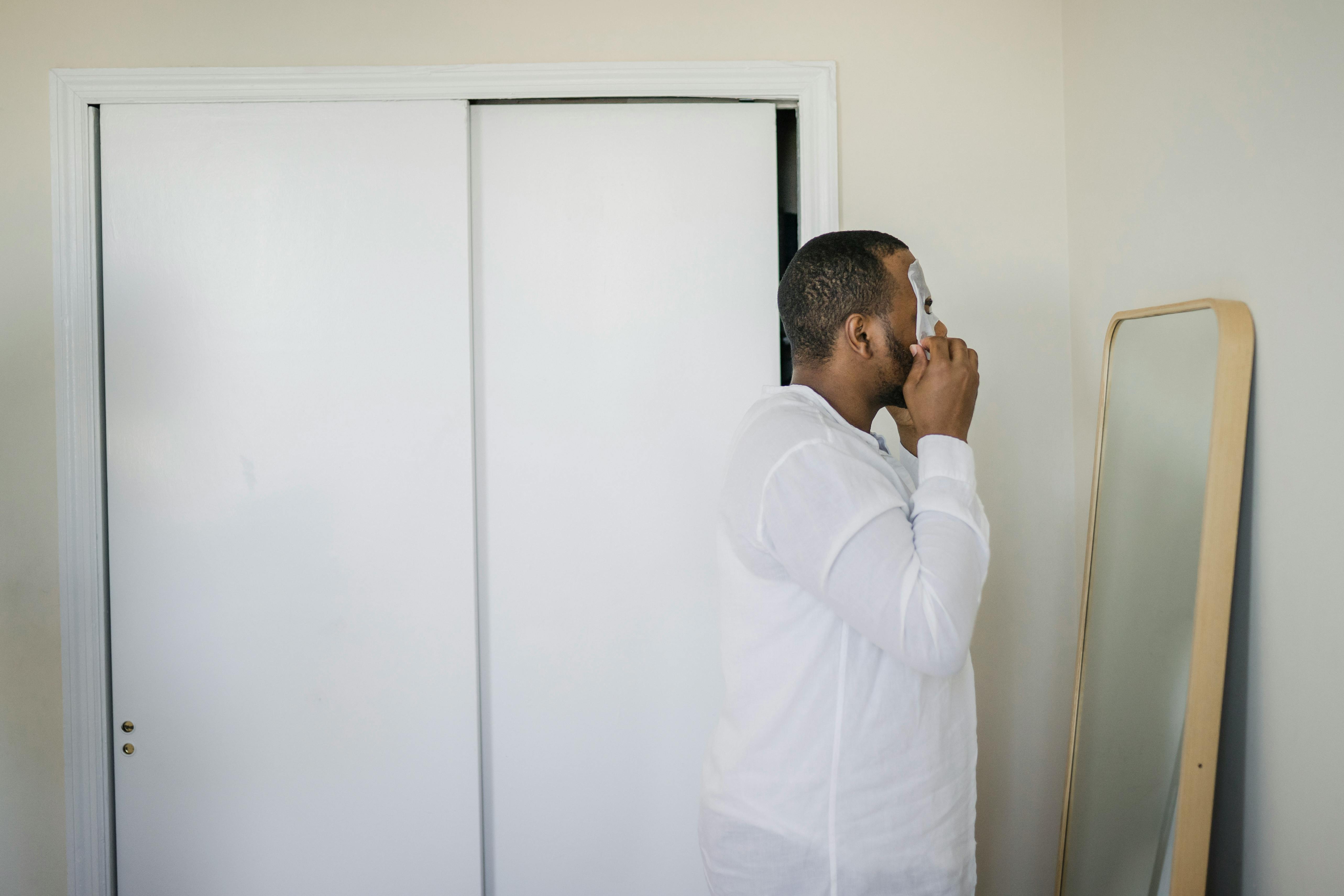 Man Holding a Mirror with Woman Reflection · Free Stock Photo
