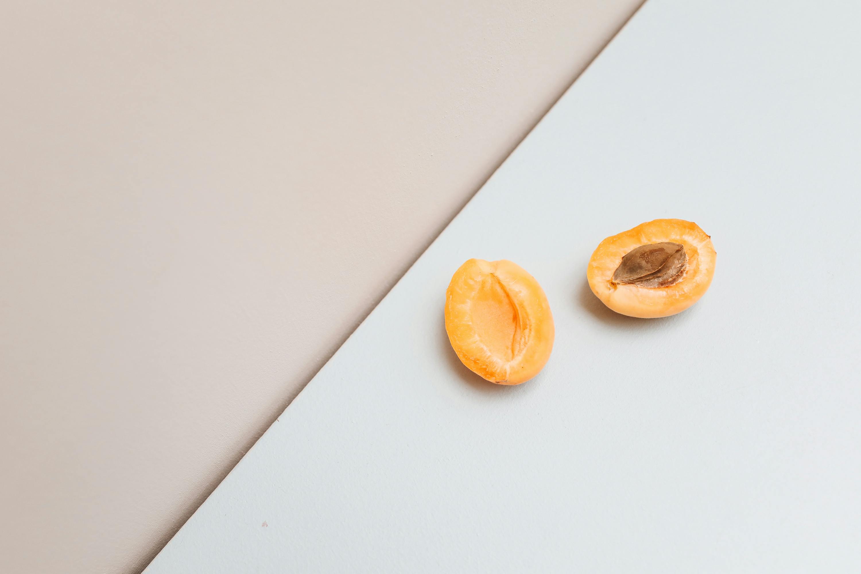 Close-Up Photograph of an Opened Apricot · Free Stock Photo