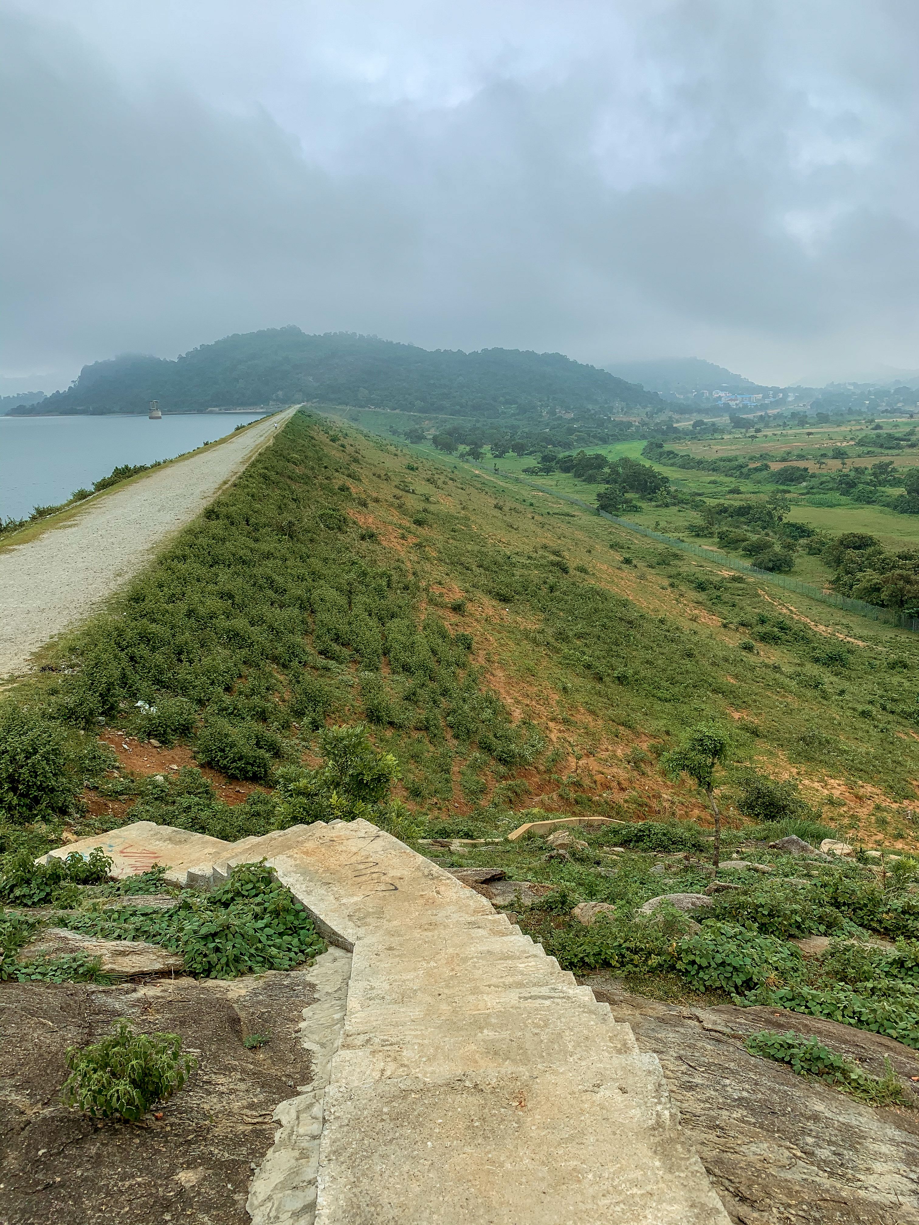 Footpath by Seaside with Mountains in Distance · Free Stock Photo