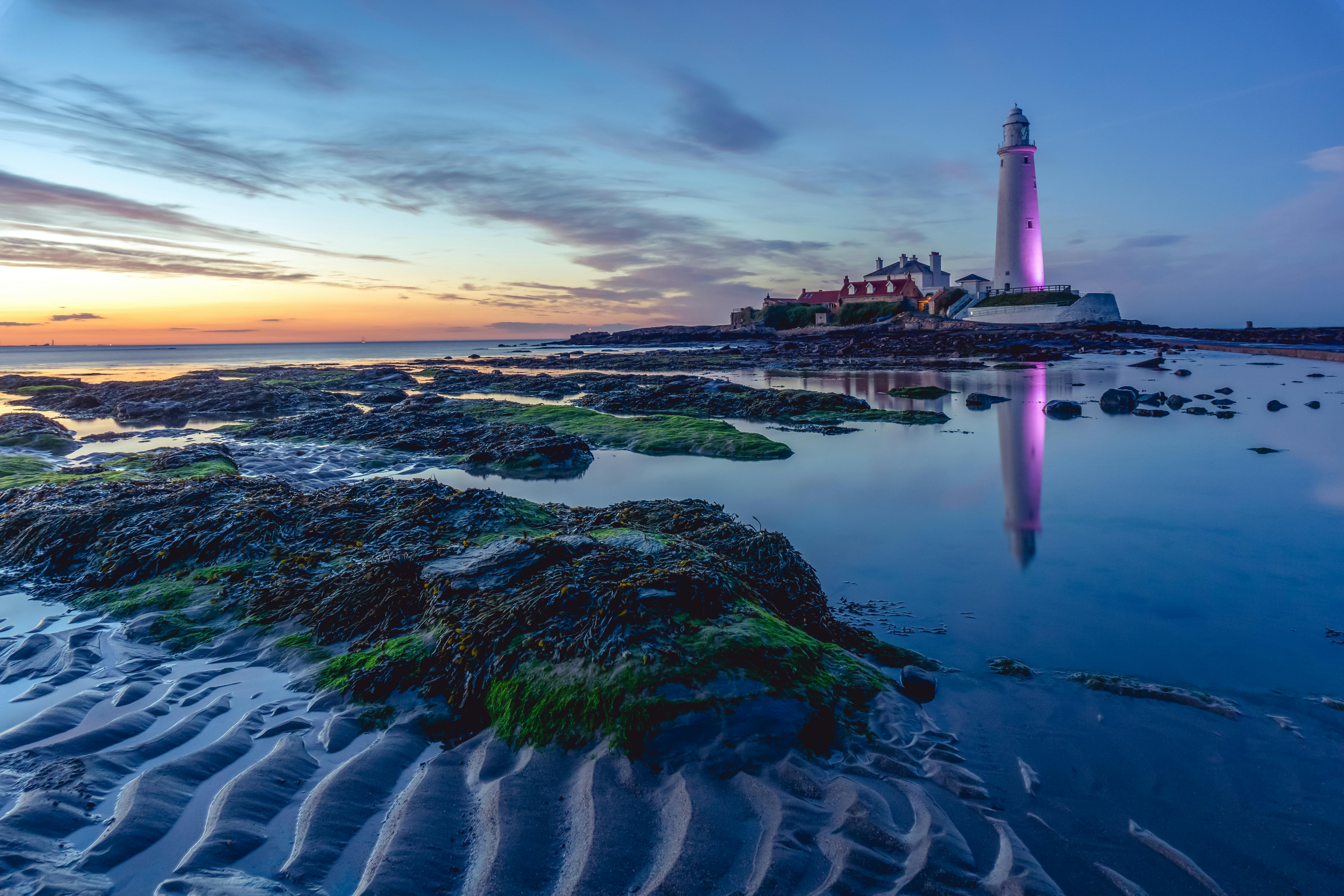 Illuminated Lighthouse during Sunset · Free Stock Photo