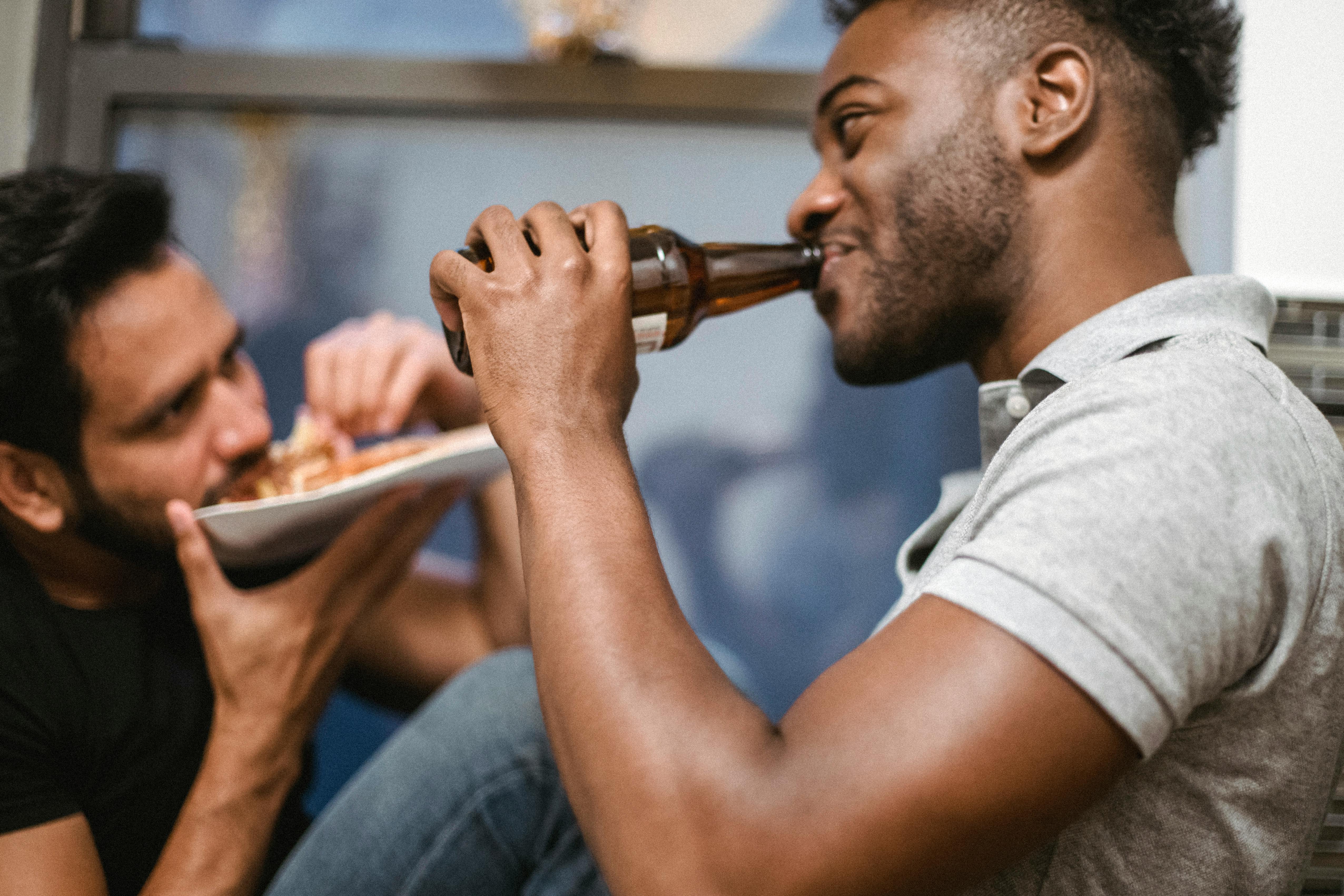Men Eating and Drinking · Free Stock Photo