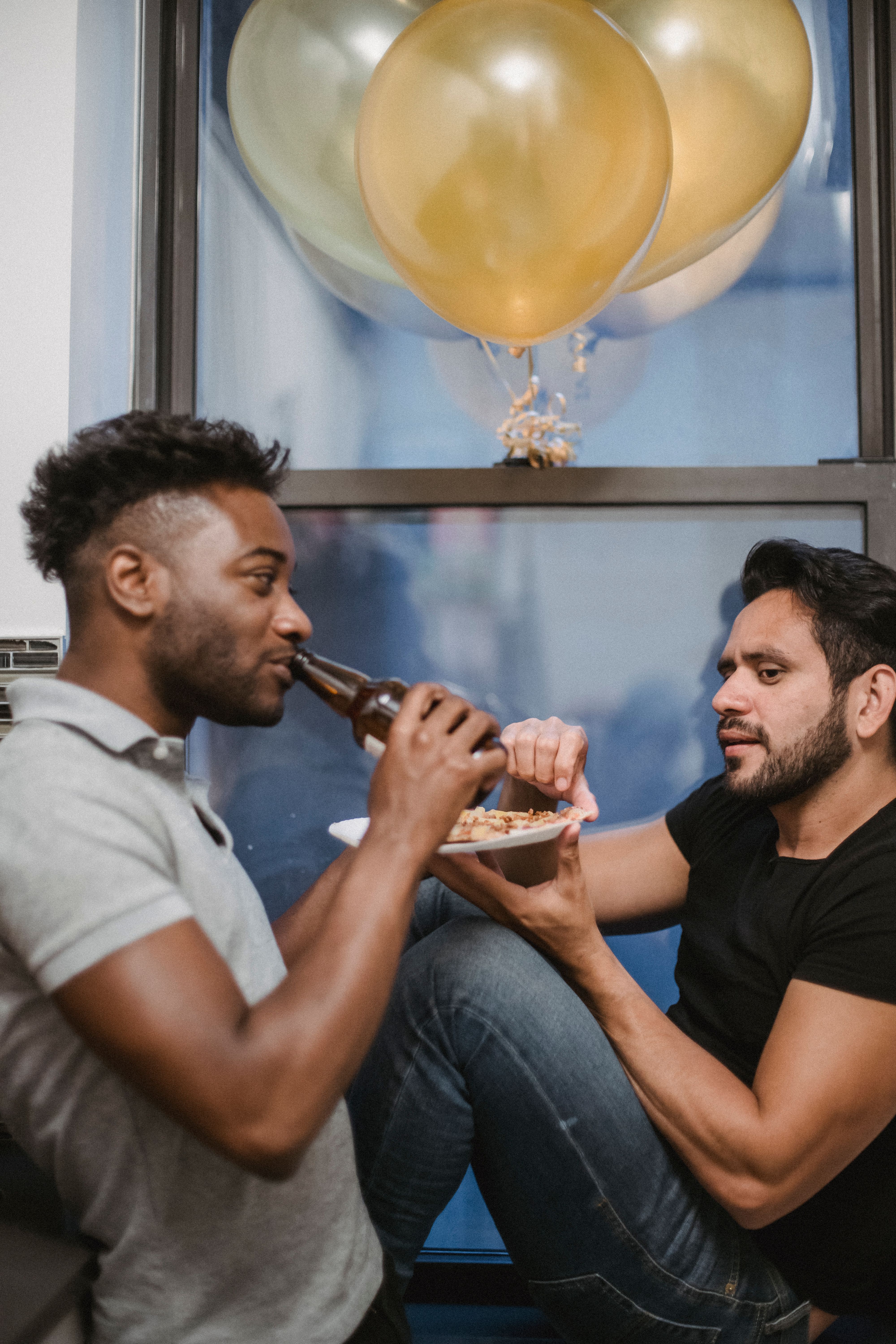 Portrait of Two Men Eating and Drinking · Free Stock Photo