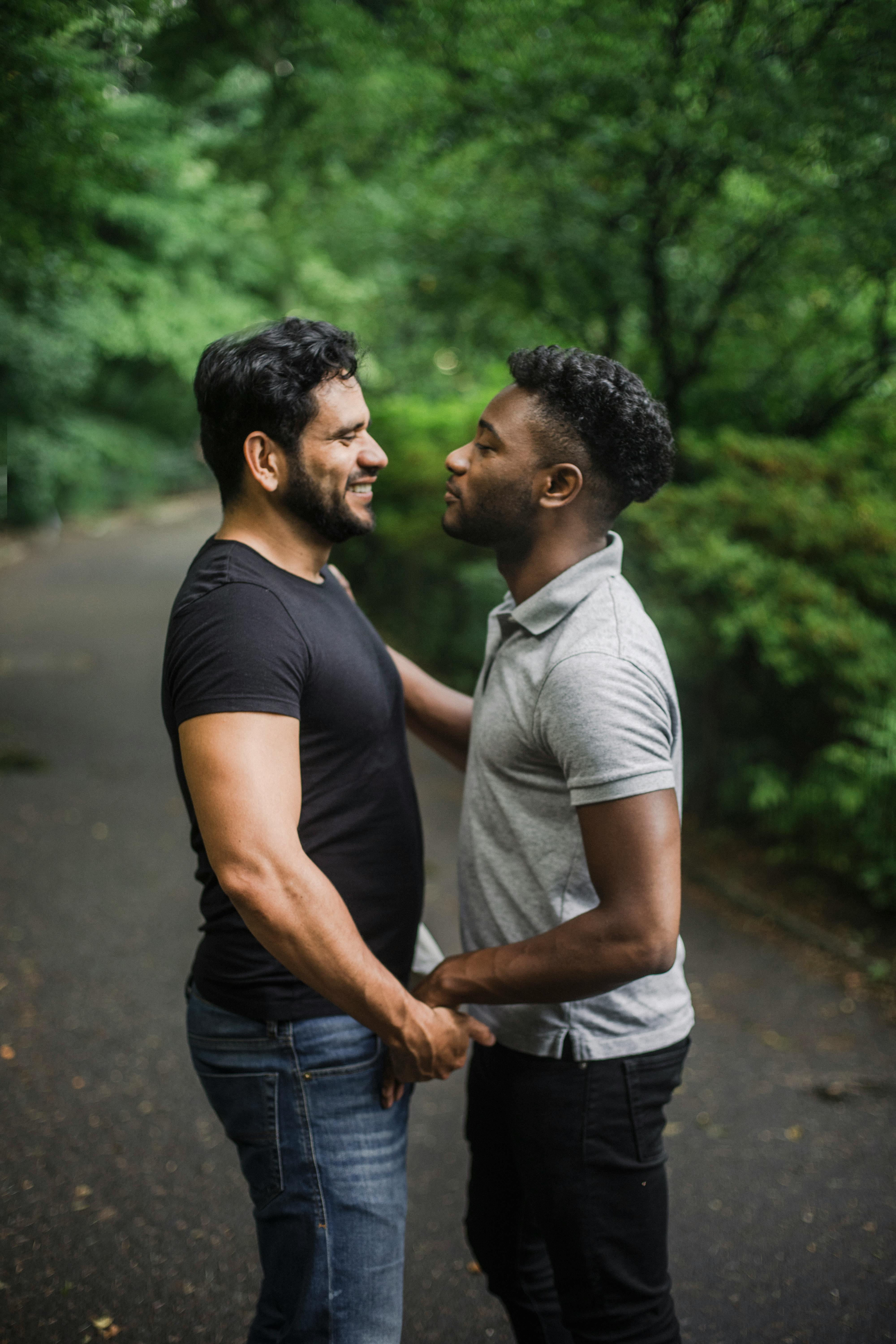Photo of Men Looking at Each Other Face to Face · Free Stock Photo