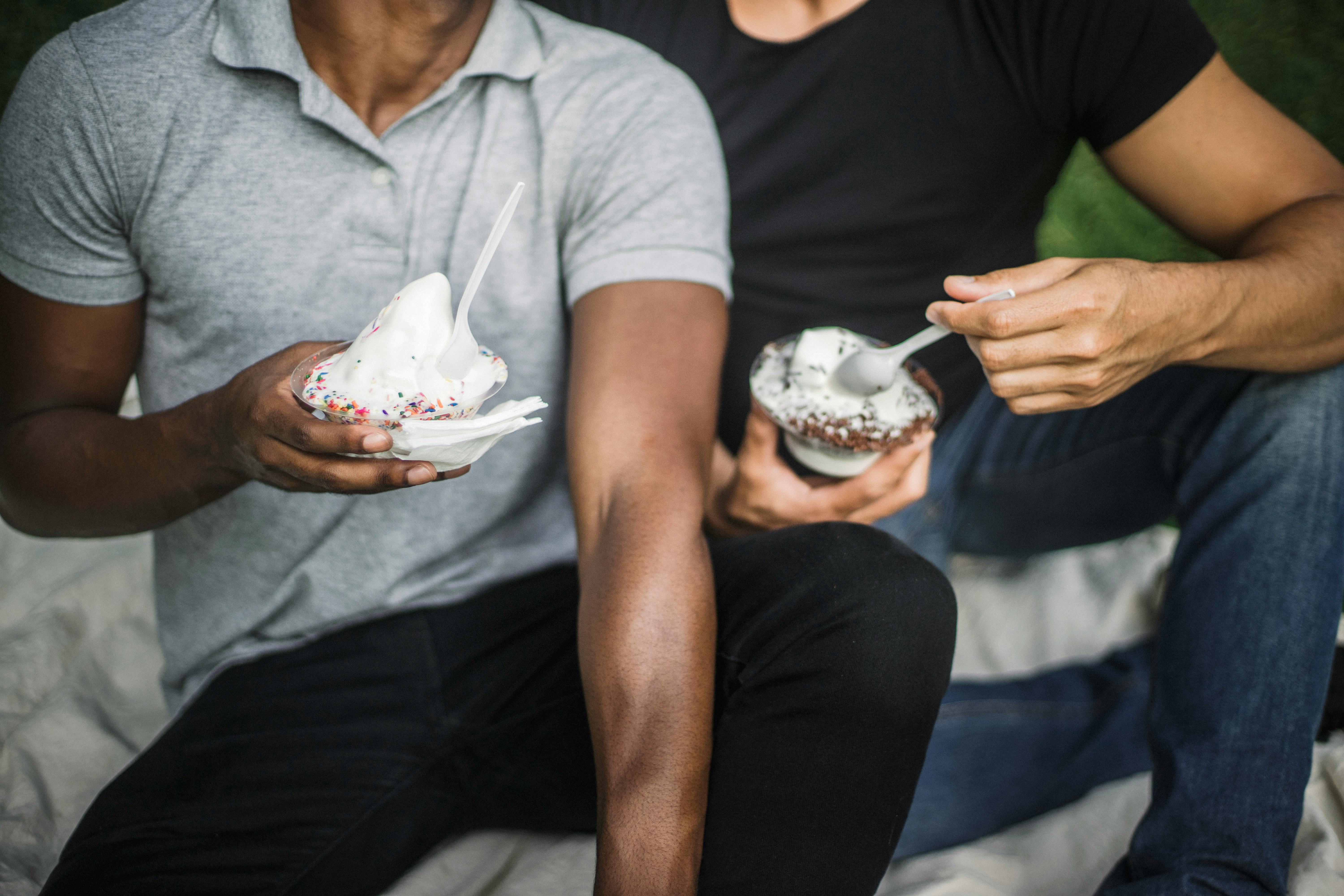 Photo of Men Holding Containers with Ice Cream · Free Stock Photo