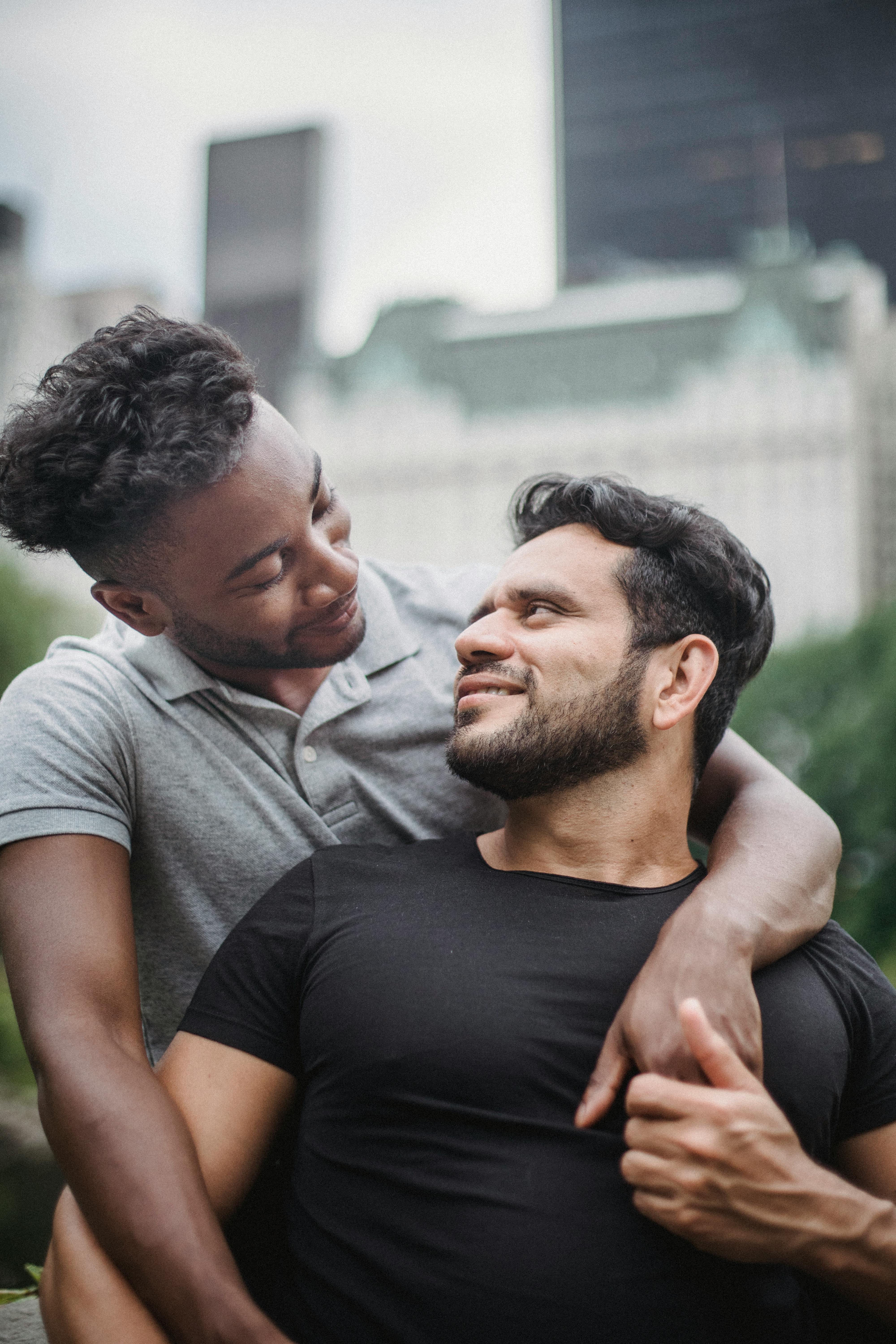 Close up of Two Man Touching Each Other Outdoors · Free Stock Photo