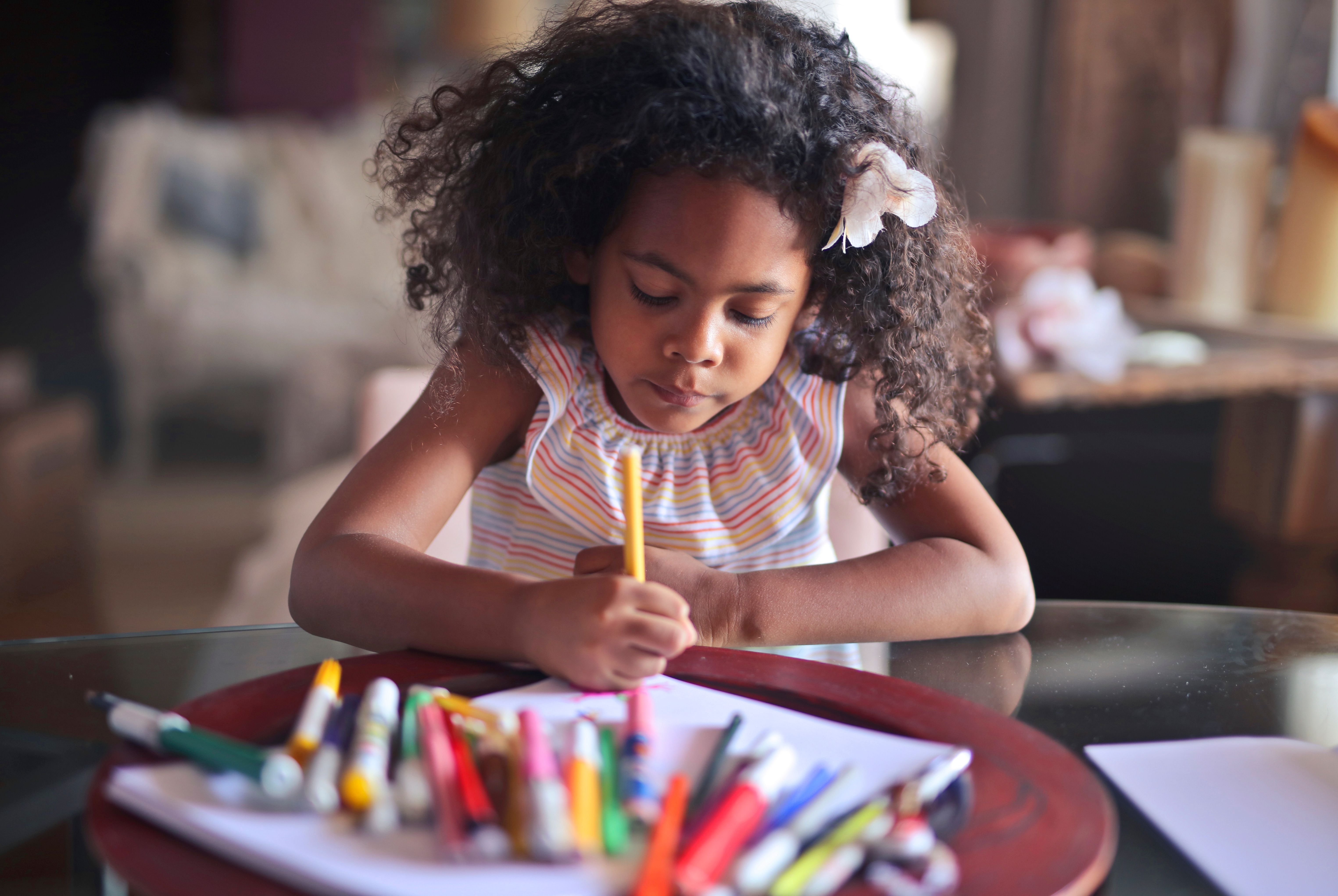 Little Girl Lying on Ground Next to Marker Drawing · Free Stock Photo