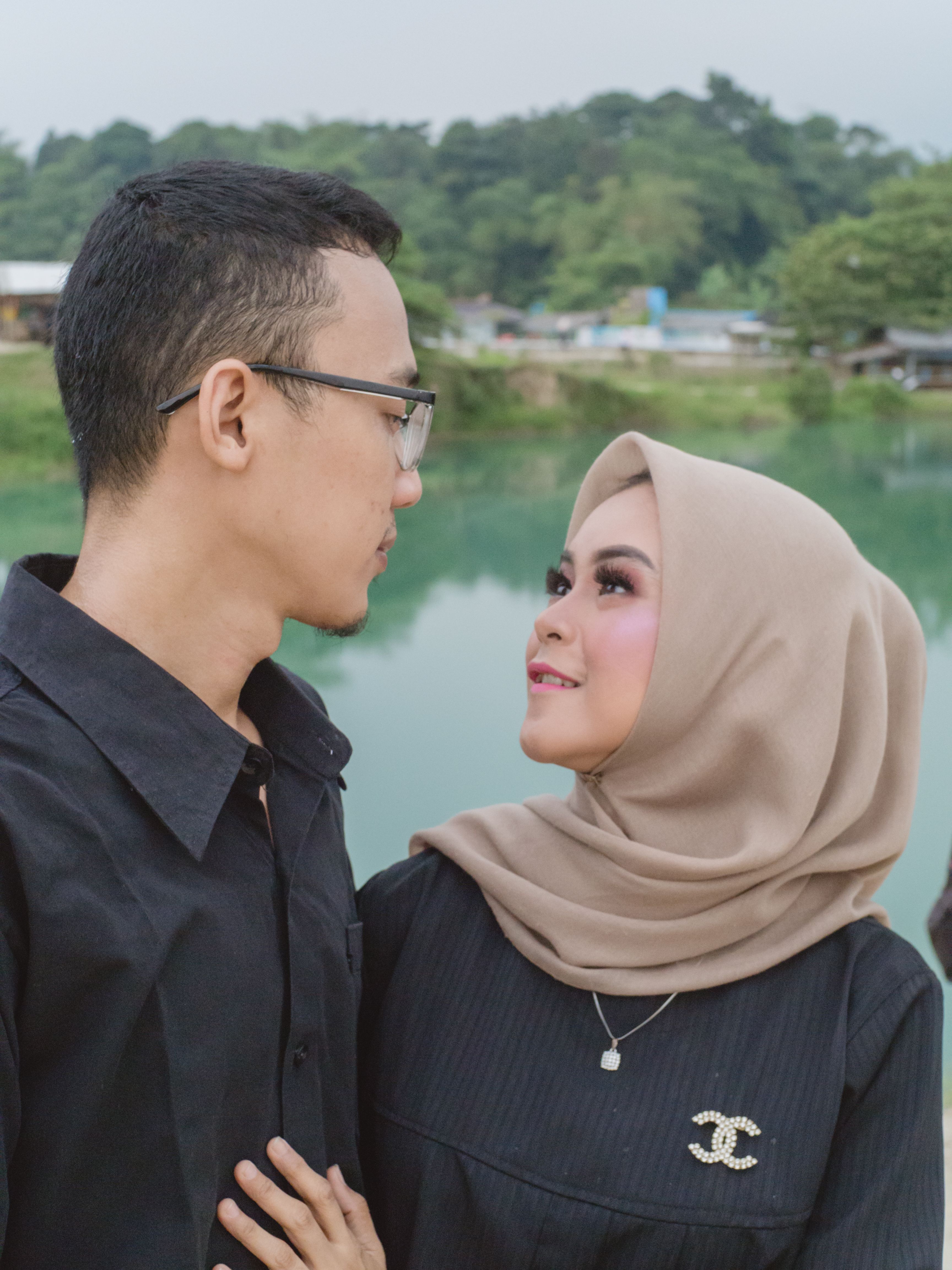 Woman in Purple Hijab Kissing Man in White Chinese Collar Shirt · Free ...
