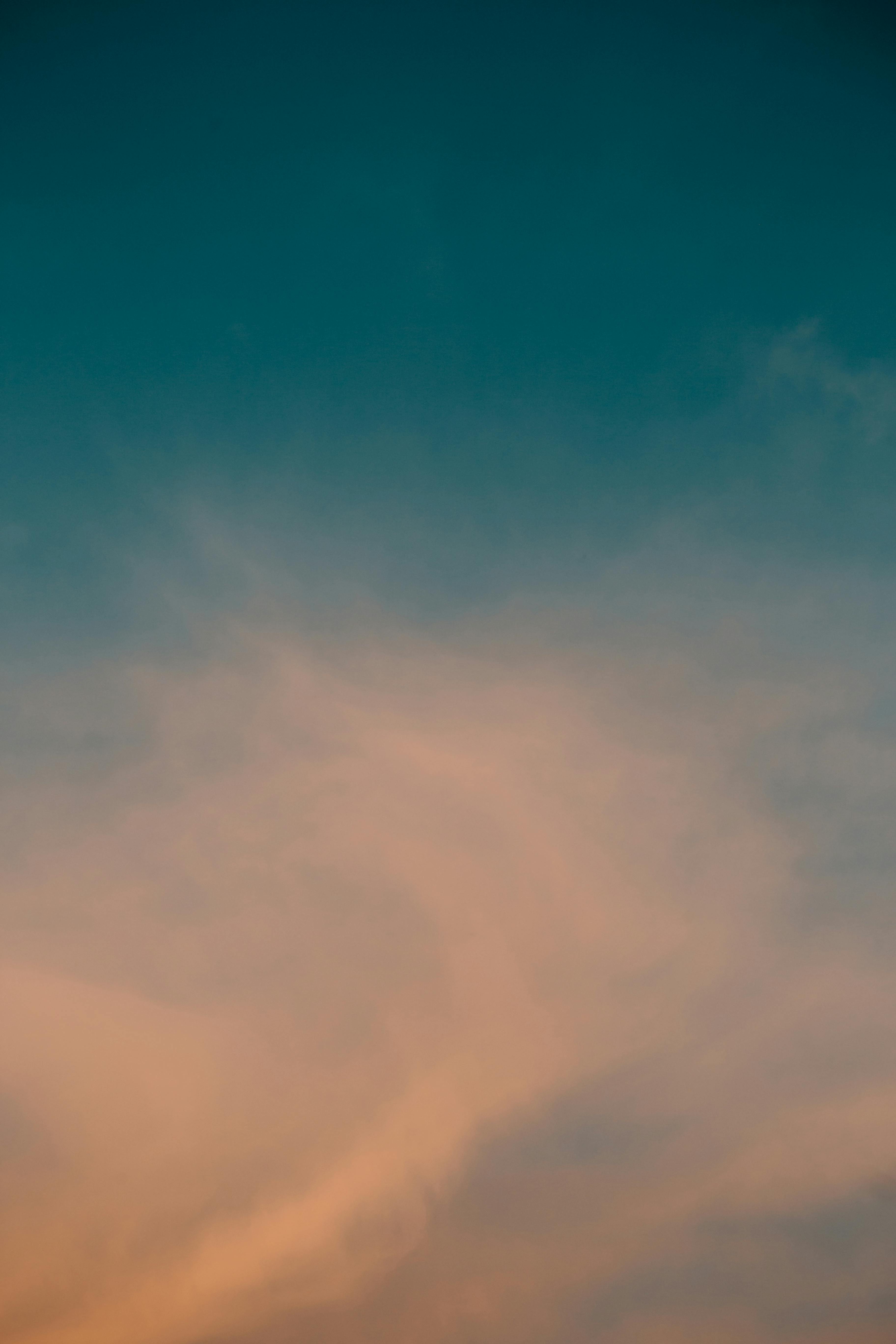 Bright cloudy sky illuminated by natural light at sunset · Free Stock Photo