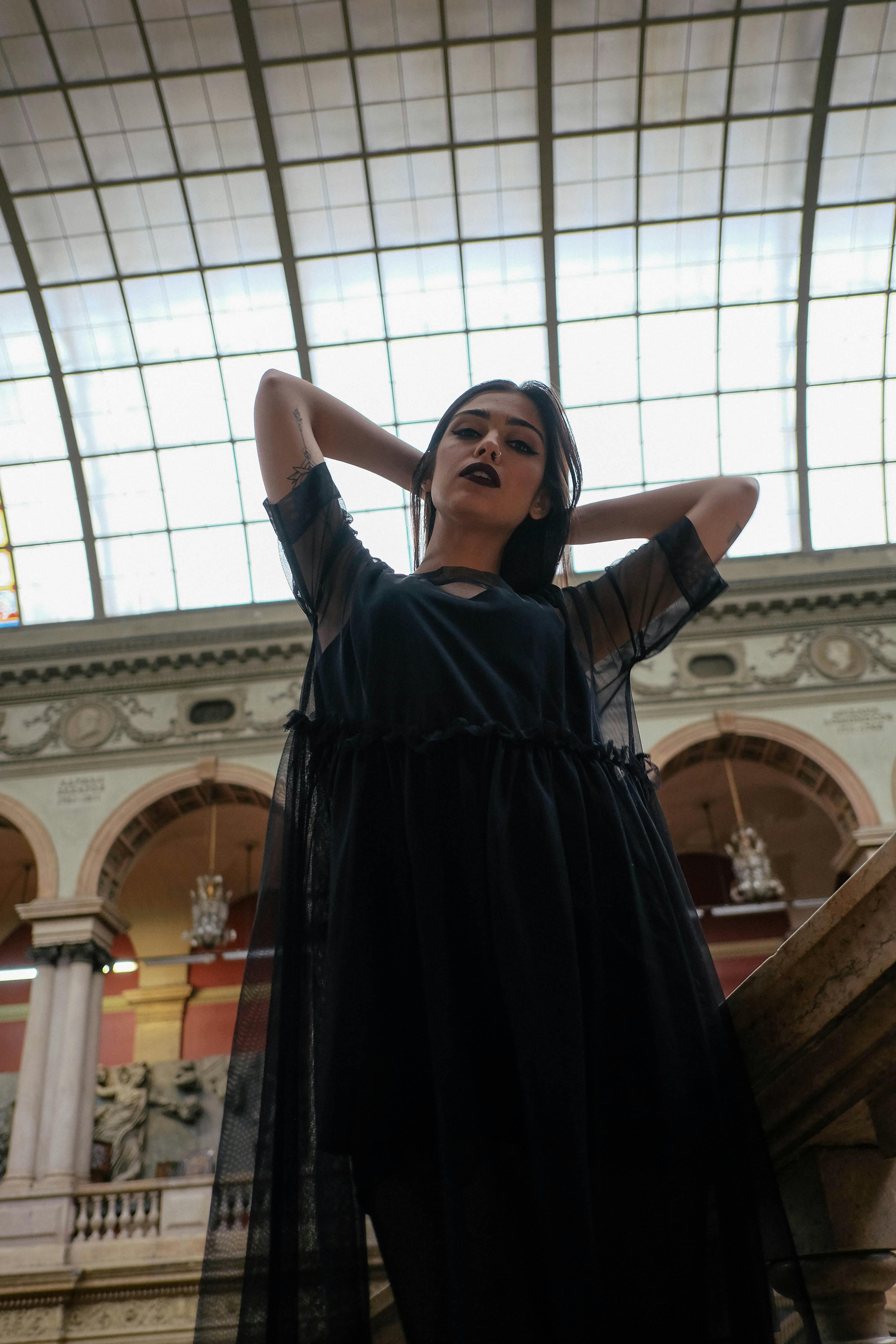 Stylish woman with makeup in aged building · Free Stock Photo