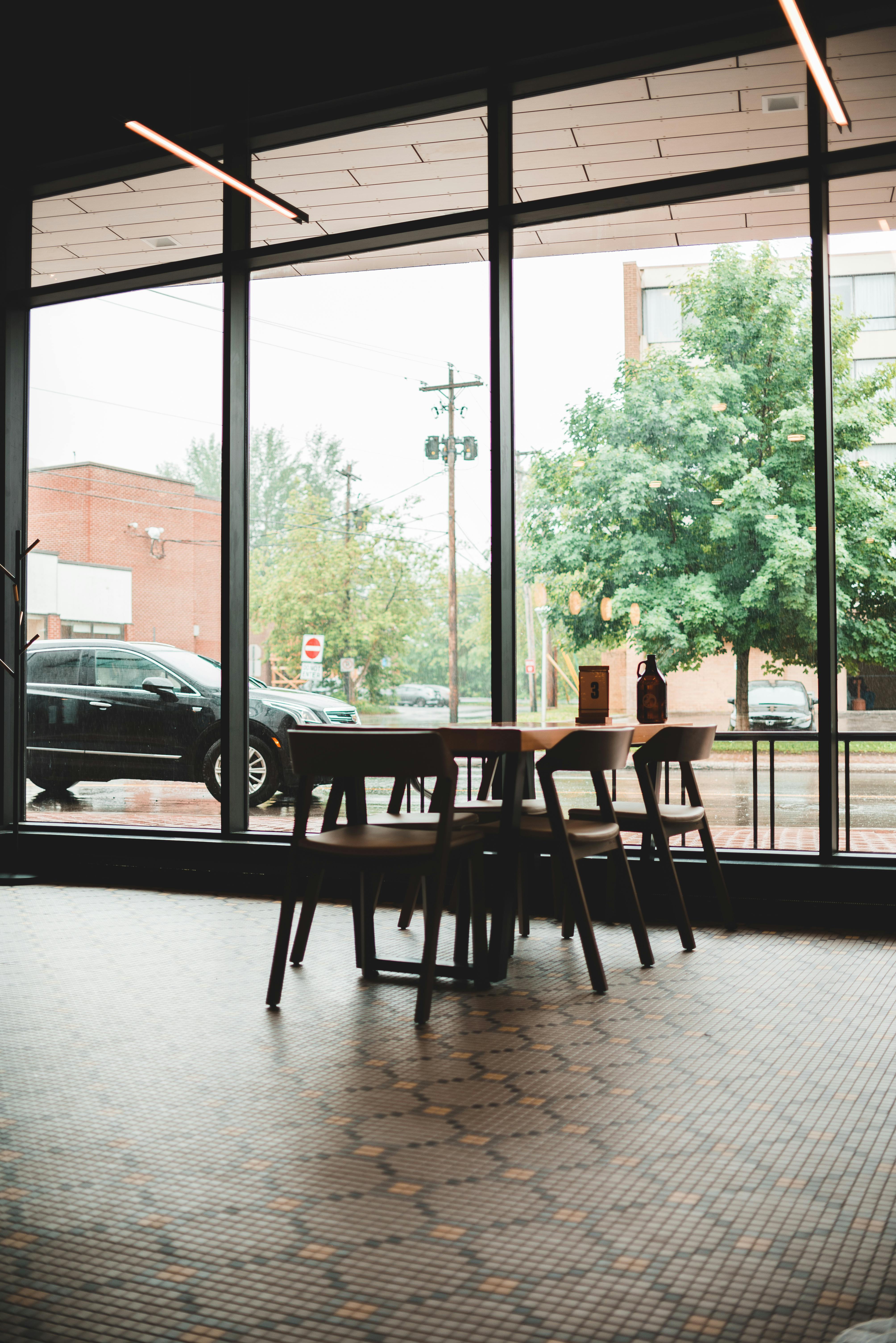 Interior of modern cafe with panoramic windows · Free Stock Photo