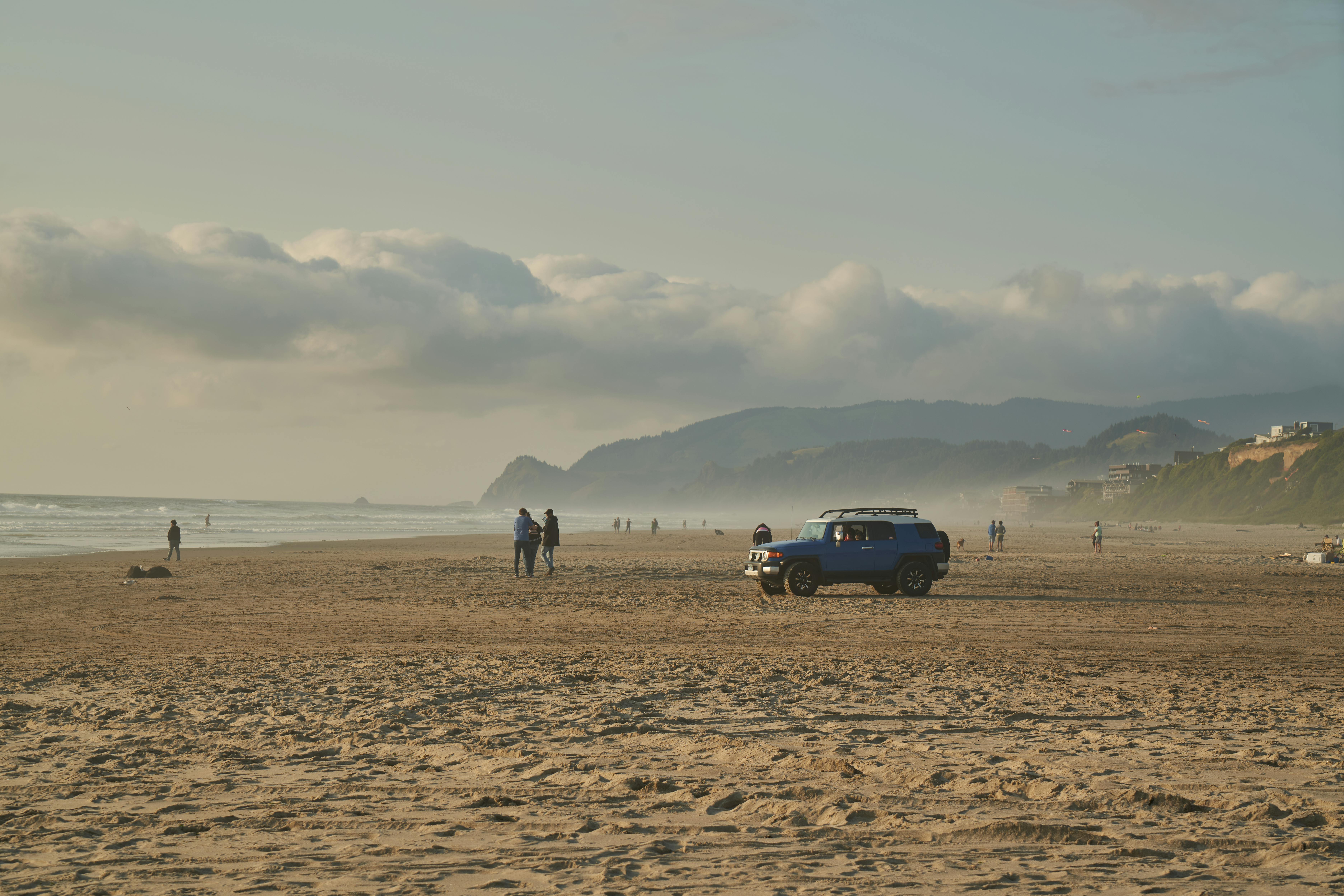 Beach Goers on the Seashore · Free Stock Photo