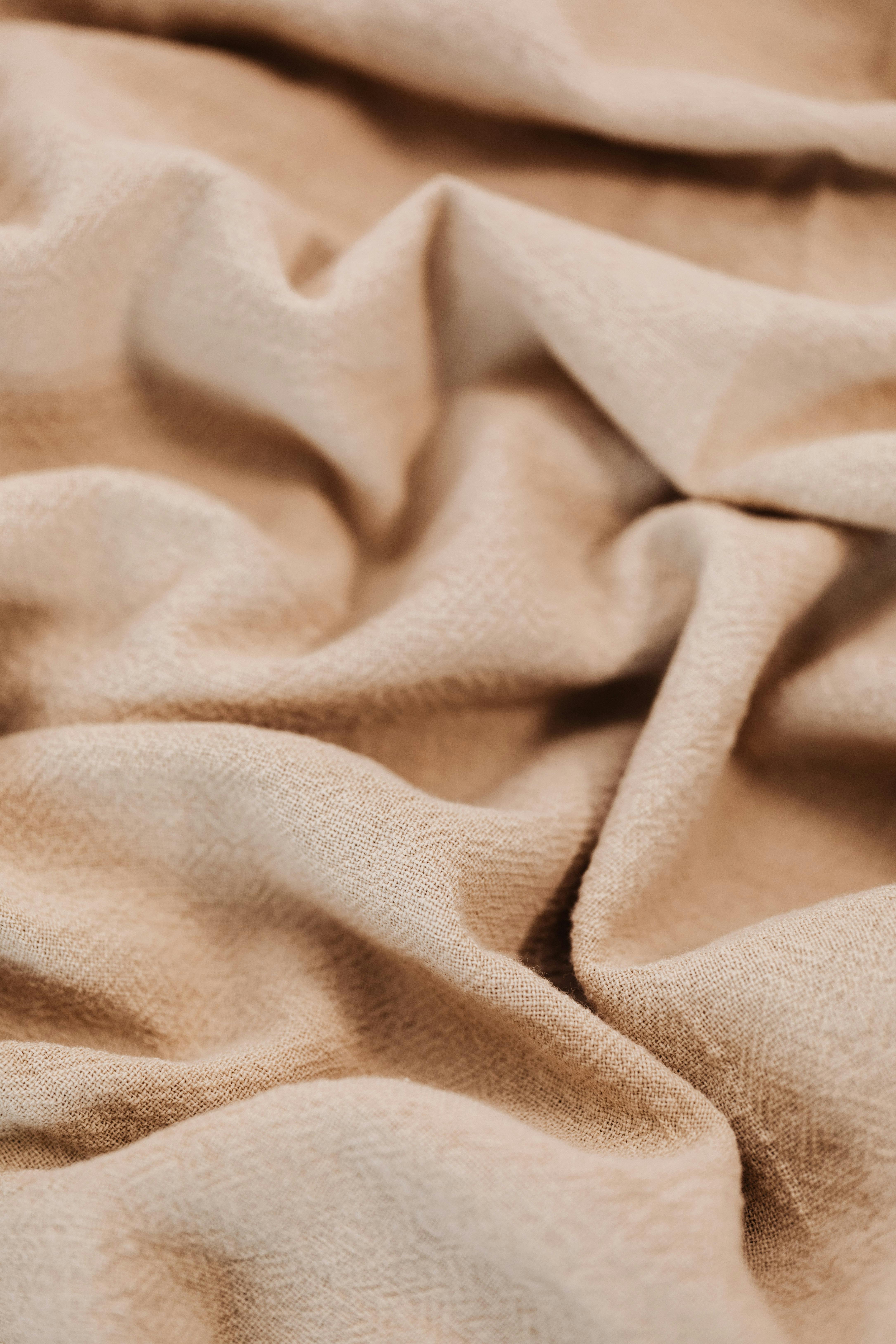 Close-Up Photo of Beige Textile · Free Stock Photo