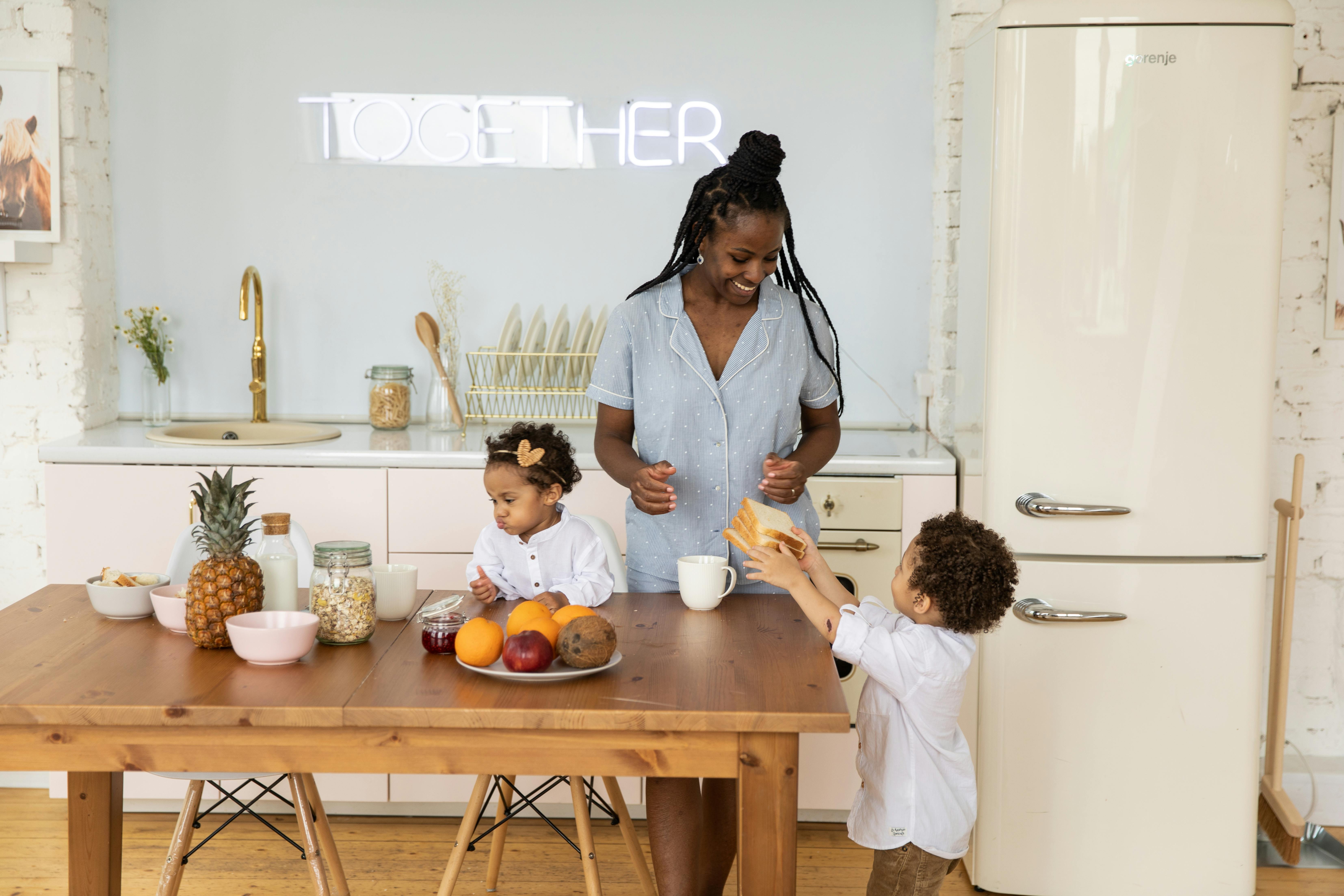Mom Preparing Breakfast For Her Kids · Free Stock Photo