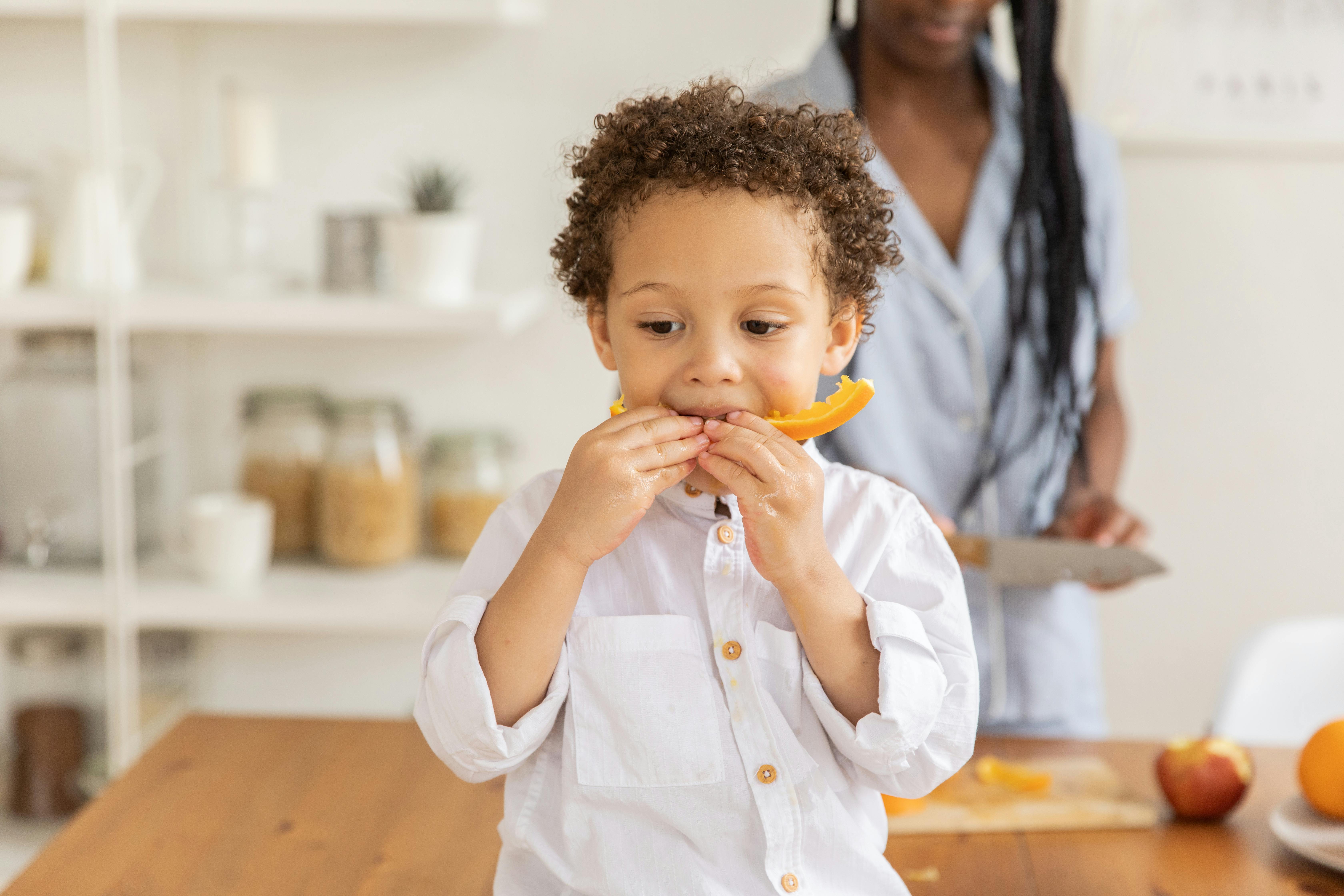 Boy Eating Fruit · Free Stock Photo