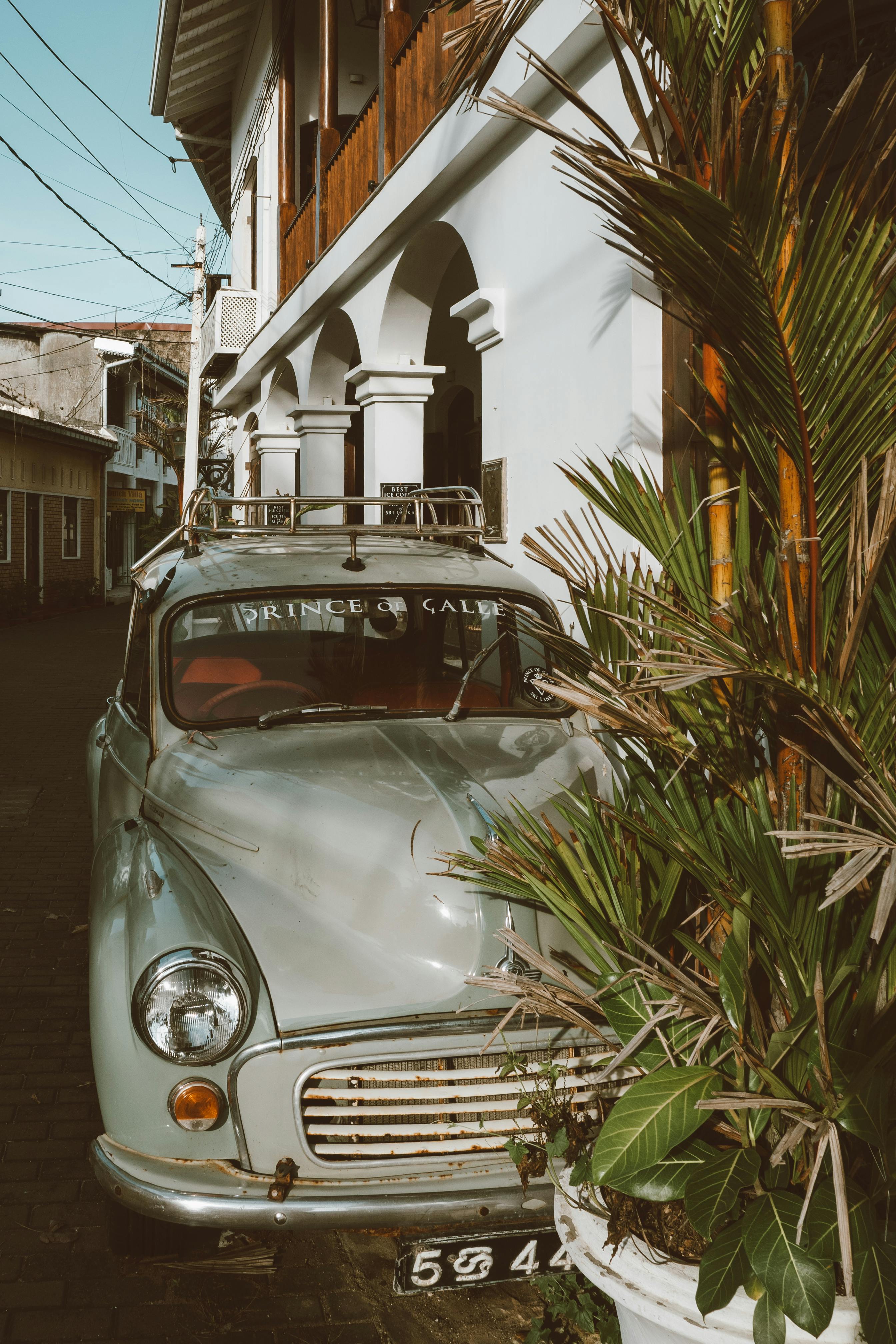 Classic Car parked outside an Old House · Free Stock Photo