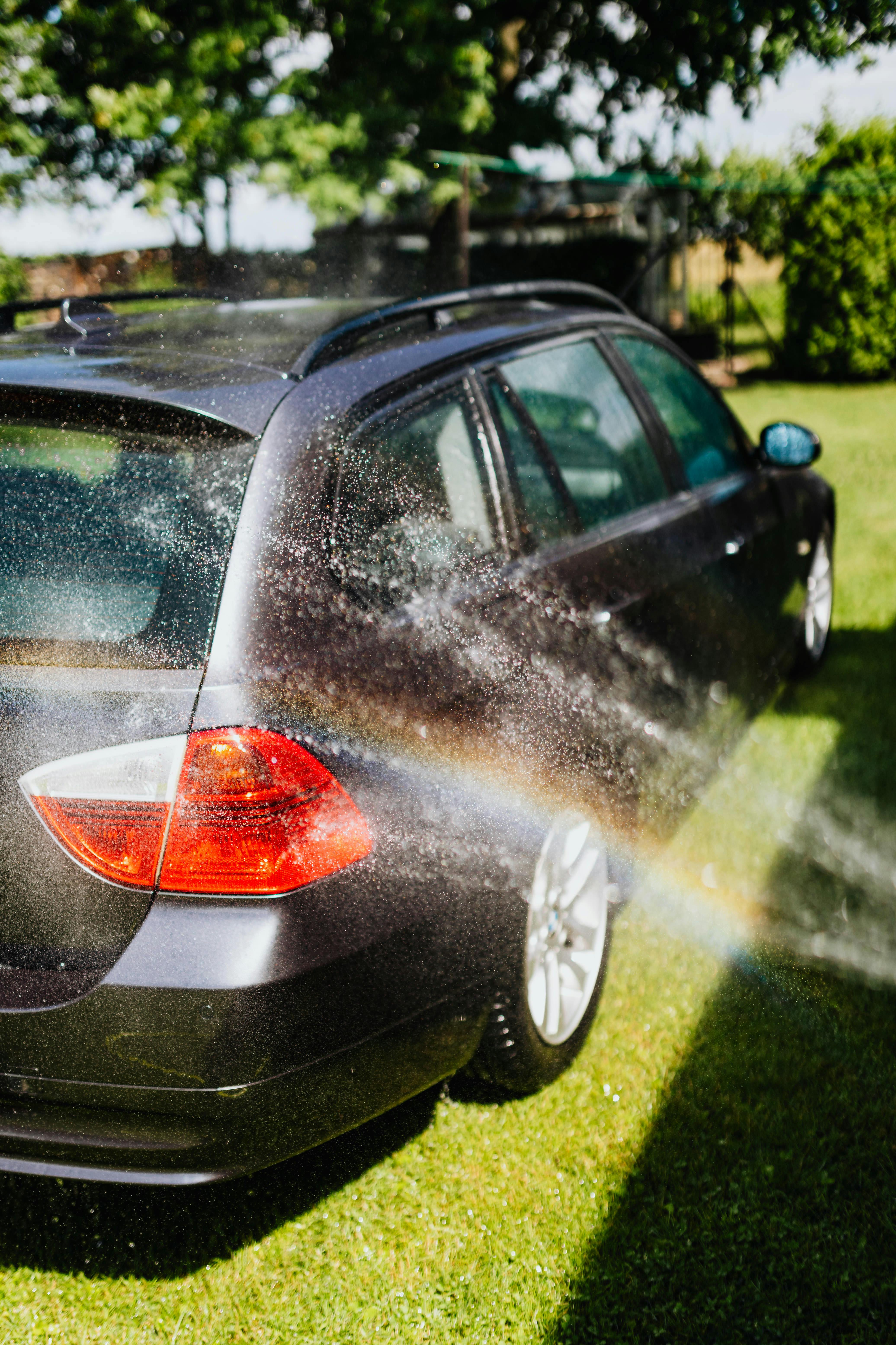 Washing of Black Car in Tilt Shift Lens · Free Stock Photo