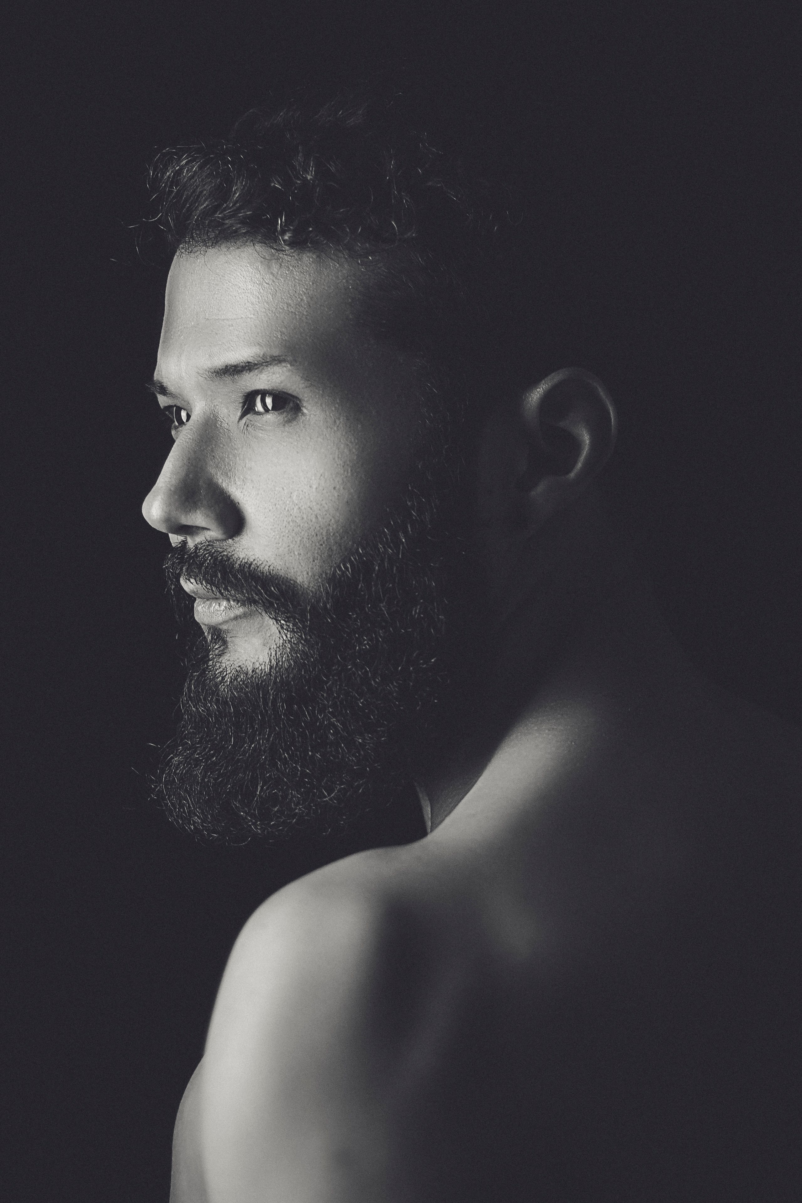 Monochrome Portrait of a Shirtless Man with Facial Hair · Free Stock Photo
