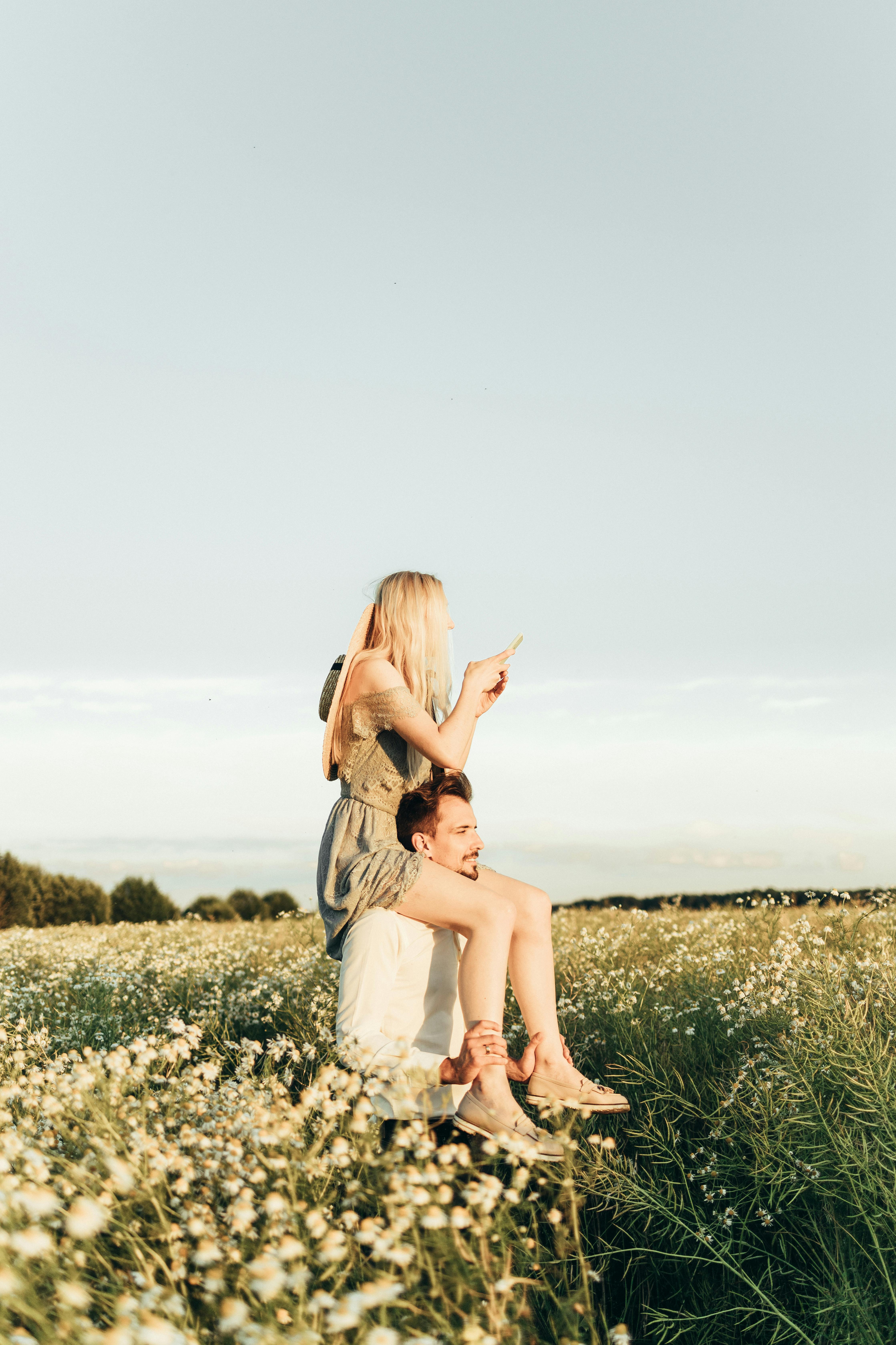 Woman Riding on Man's Shoulders · Free Stock Photo