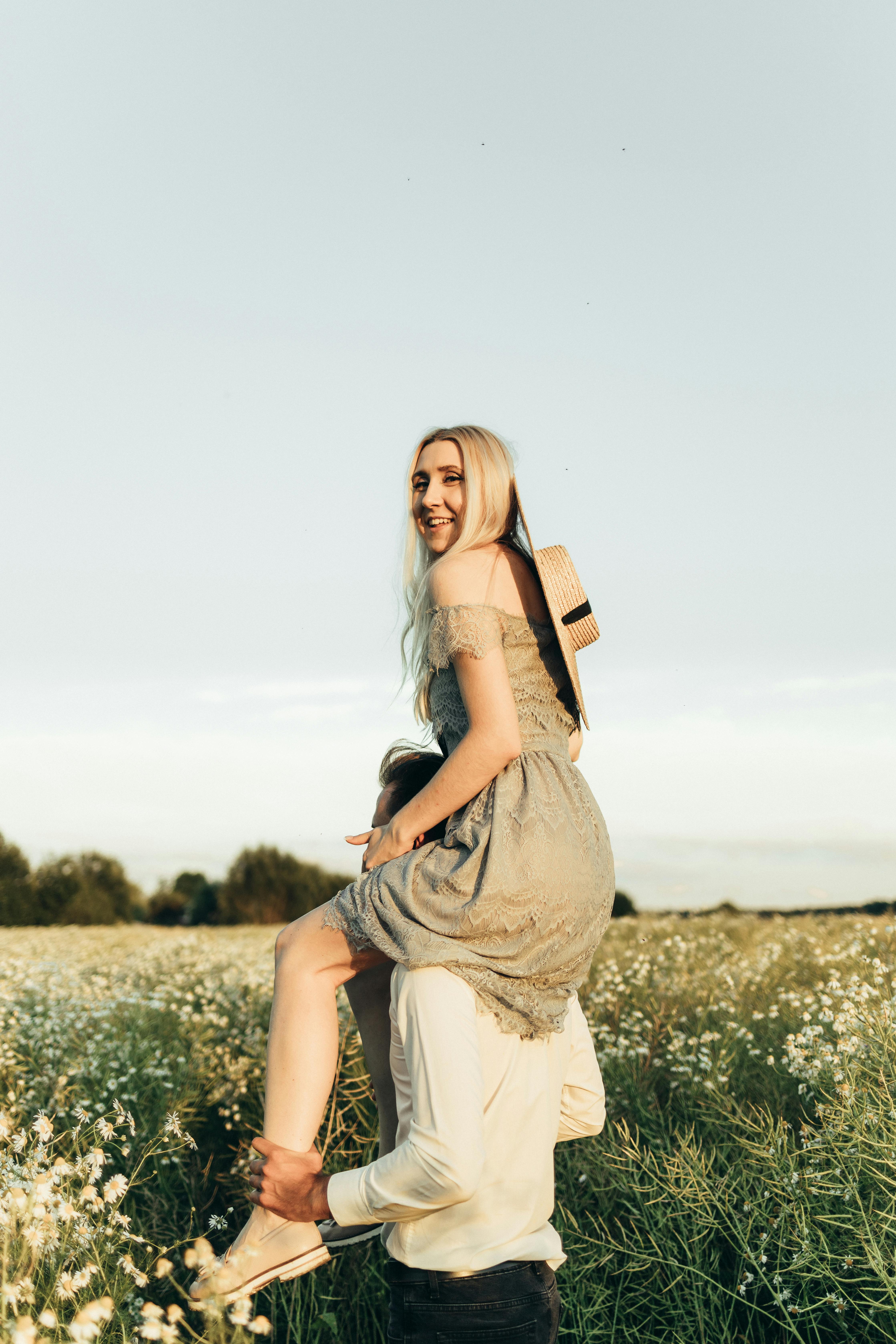 Woman Riding on Man's Shoulders · Free Stock Photo