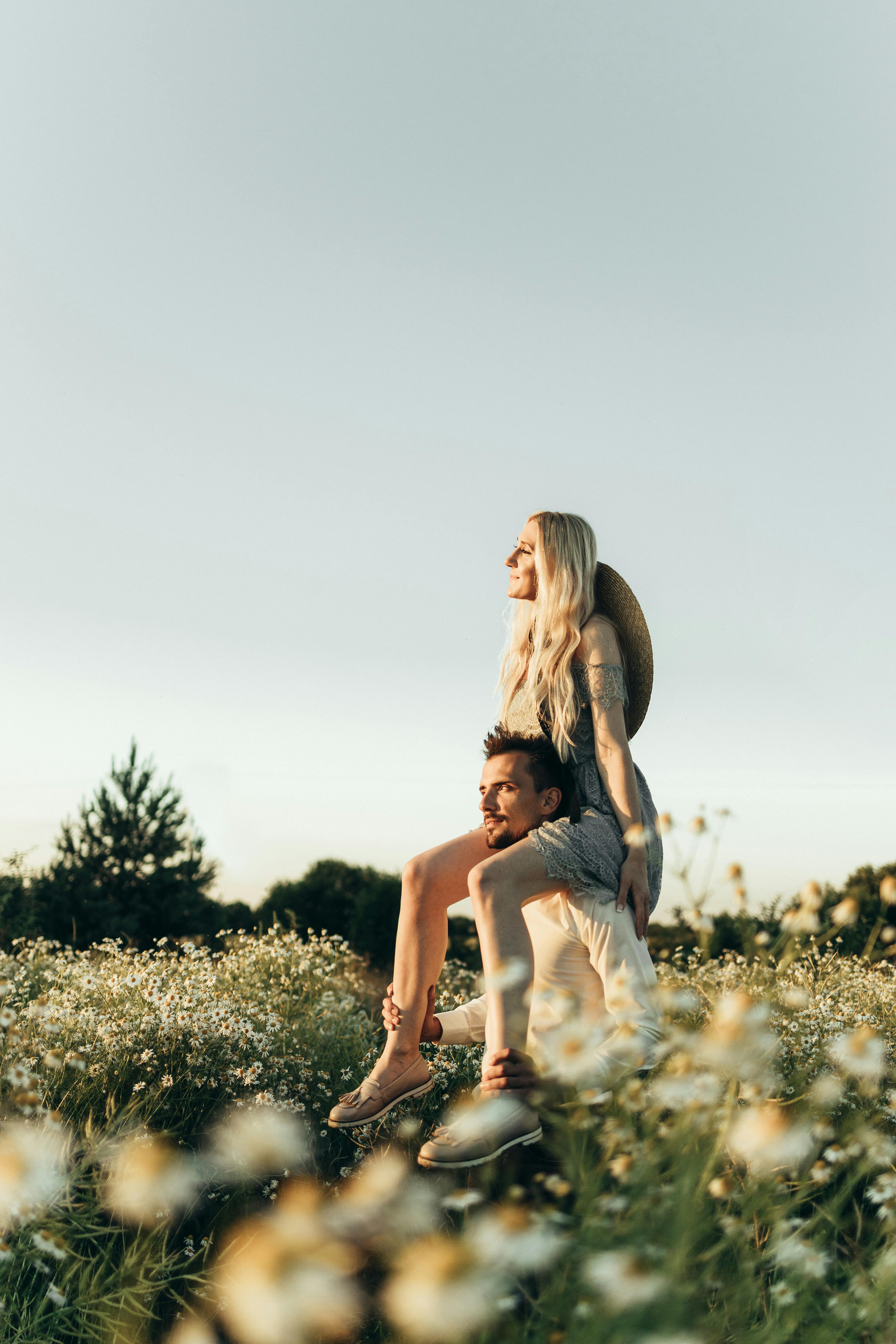Woman Riding on Man's Shoulders · Free Stock Photo