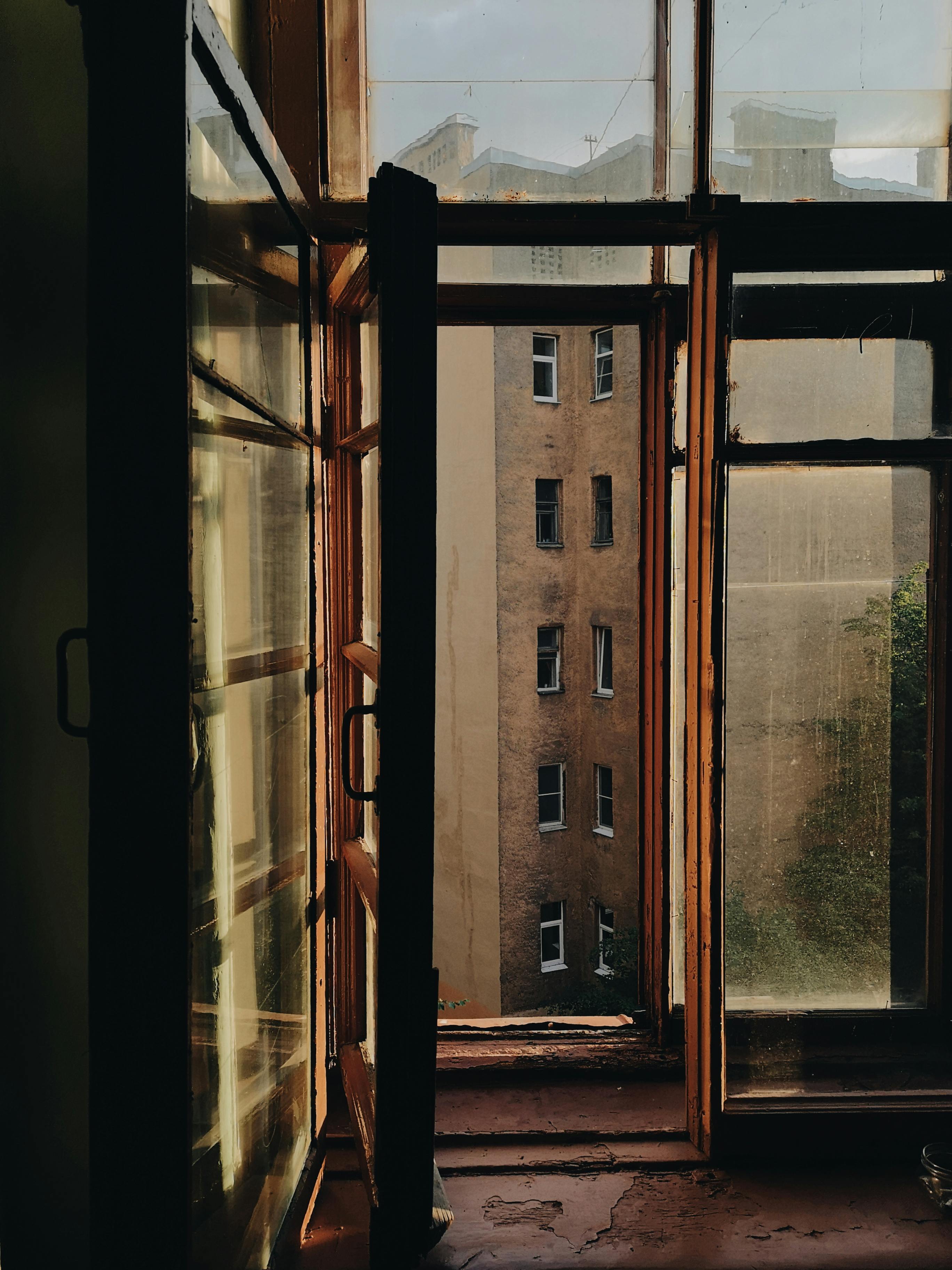 An Open Brown Wooden Framed Glass Window · Free Stock Photo