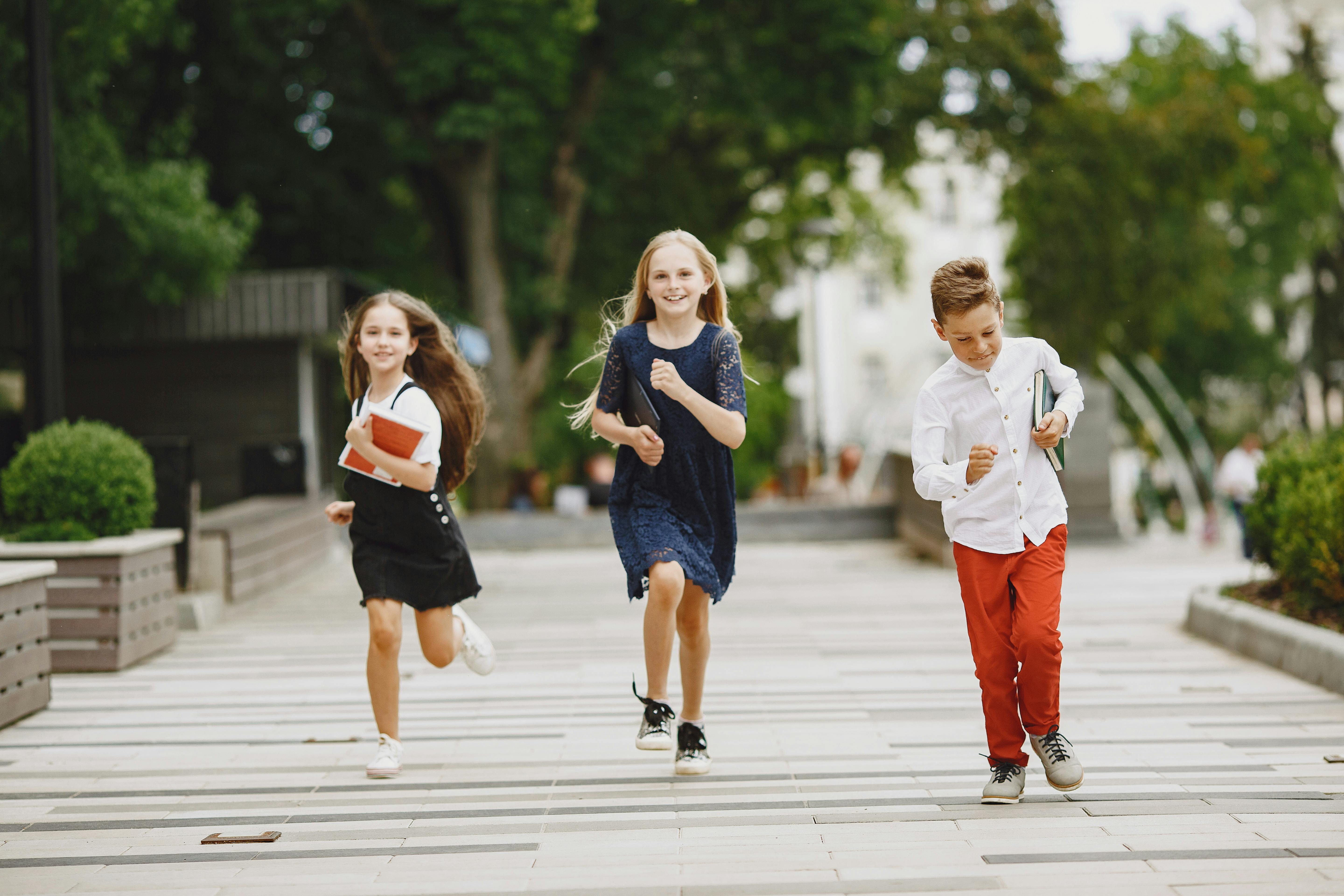 Photograph of a Group of Children Running Together · Free Stock Photo